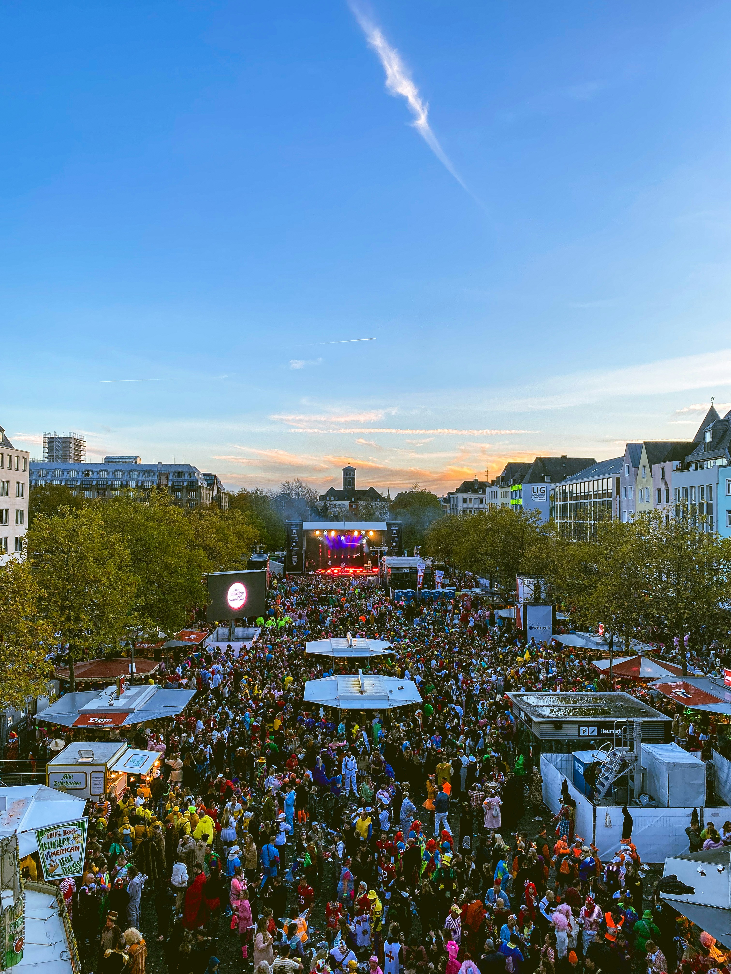 A large crowd of people standing around tents photo – Free Cologne ...