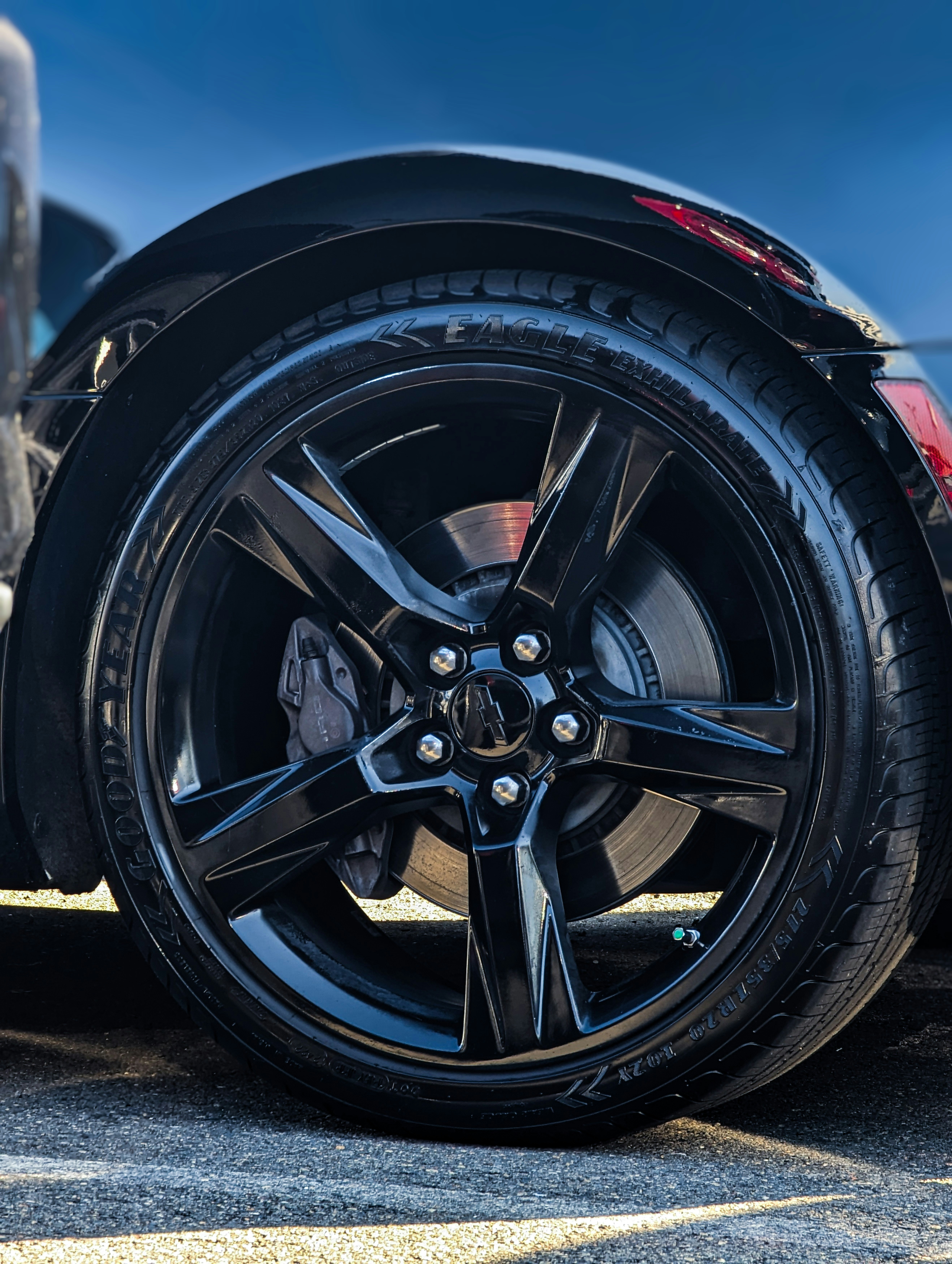 A close up of a car tire on a street photo – Free Alloy wheel Image on ...