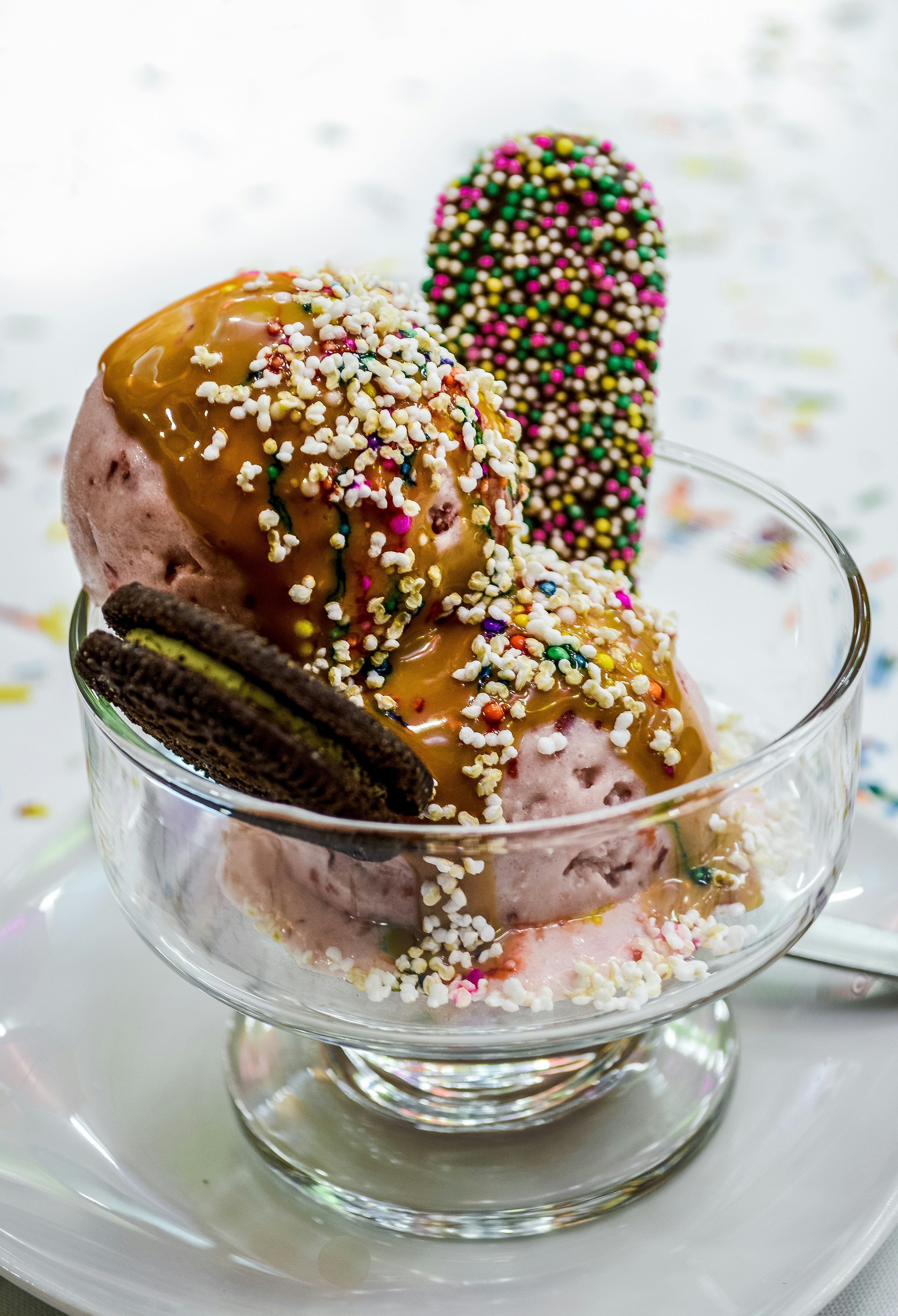 An ice cream sundae with sprinkles and a cookie photo – Free Ice cream ...