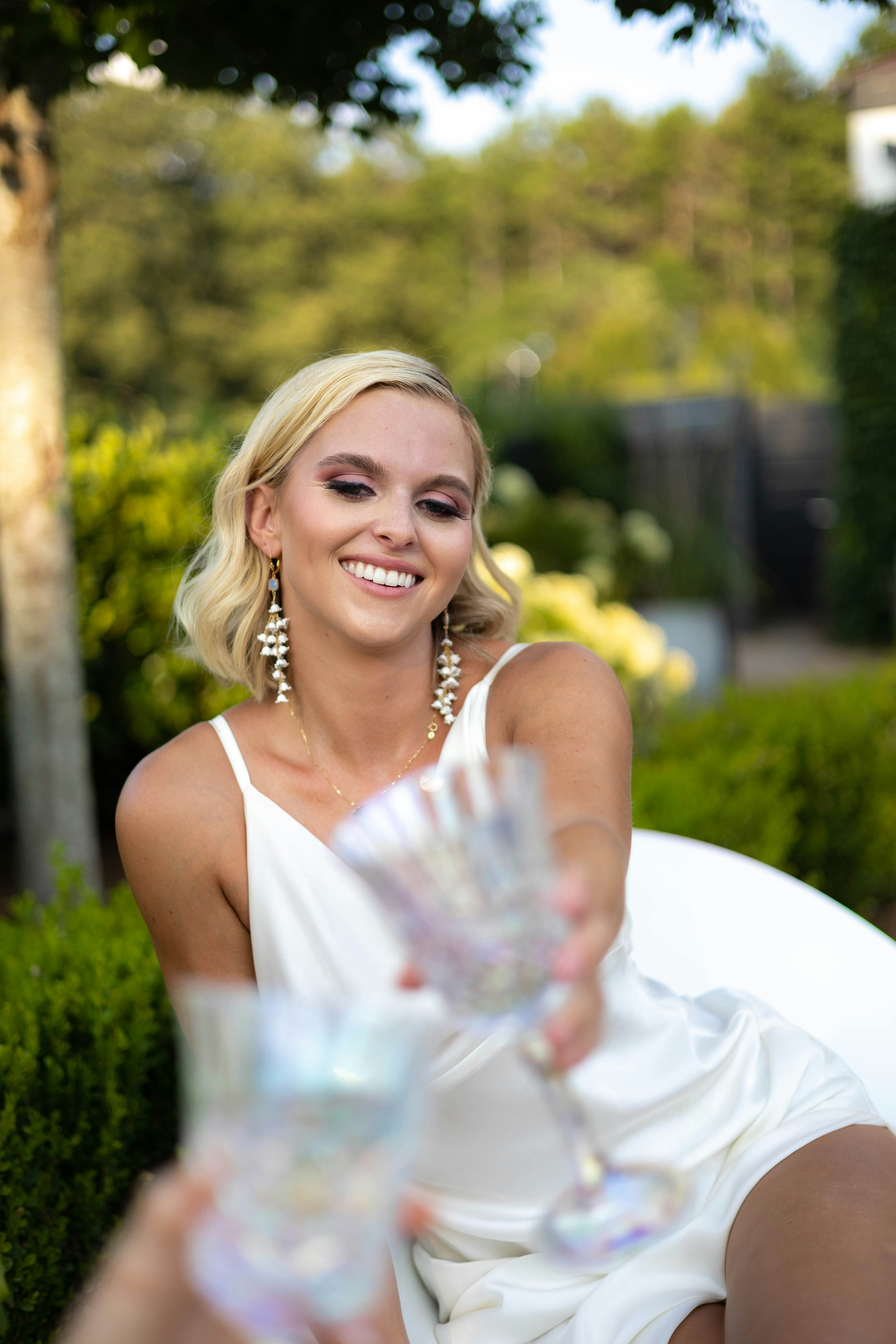 Sunlit Garden Toast: a radiant smile in a candid celebration
