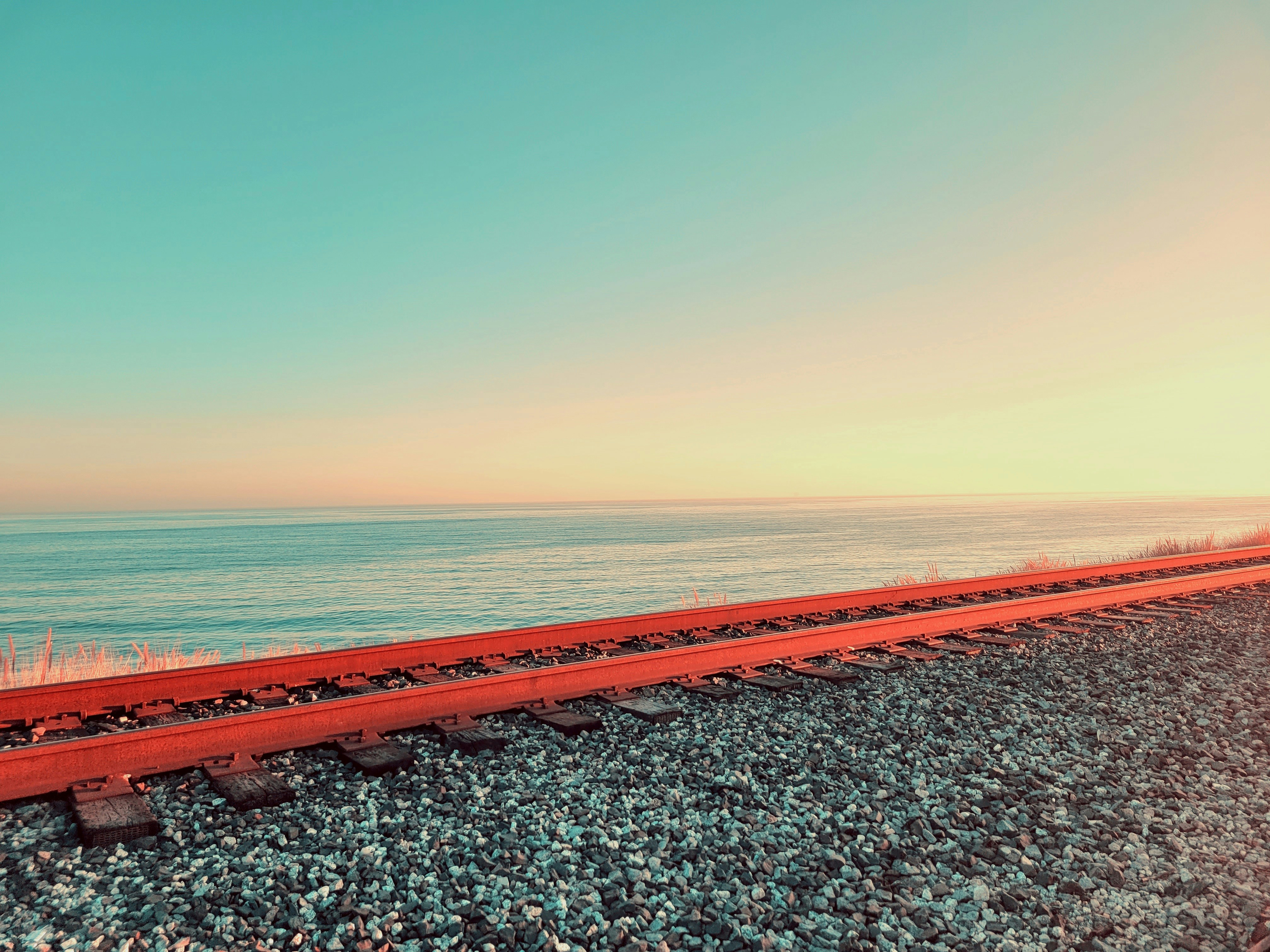Rails at the Edge: Quiet Sunrise by the Sea