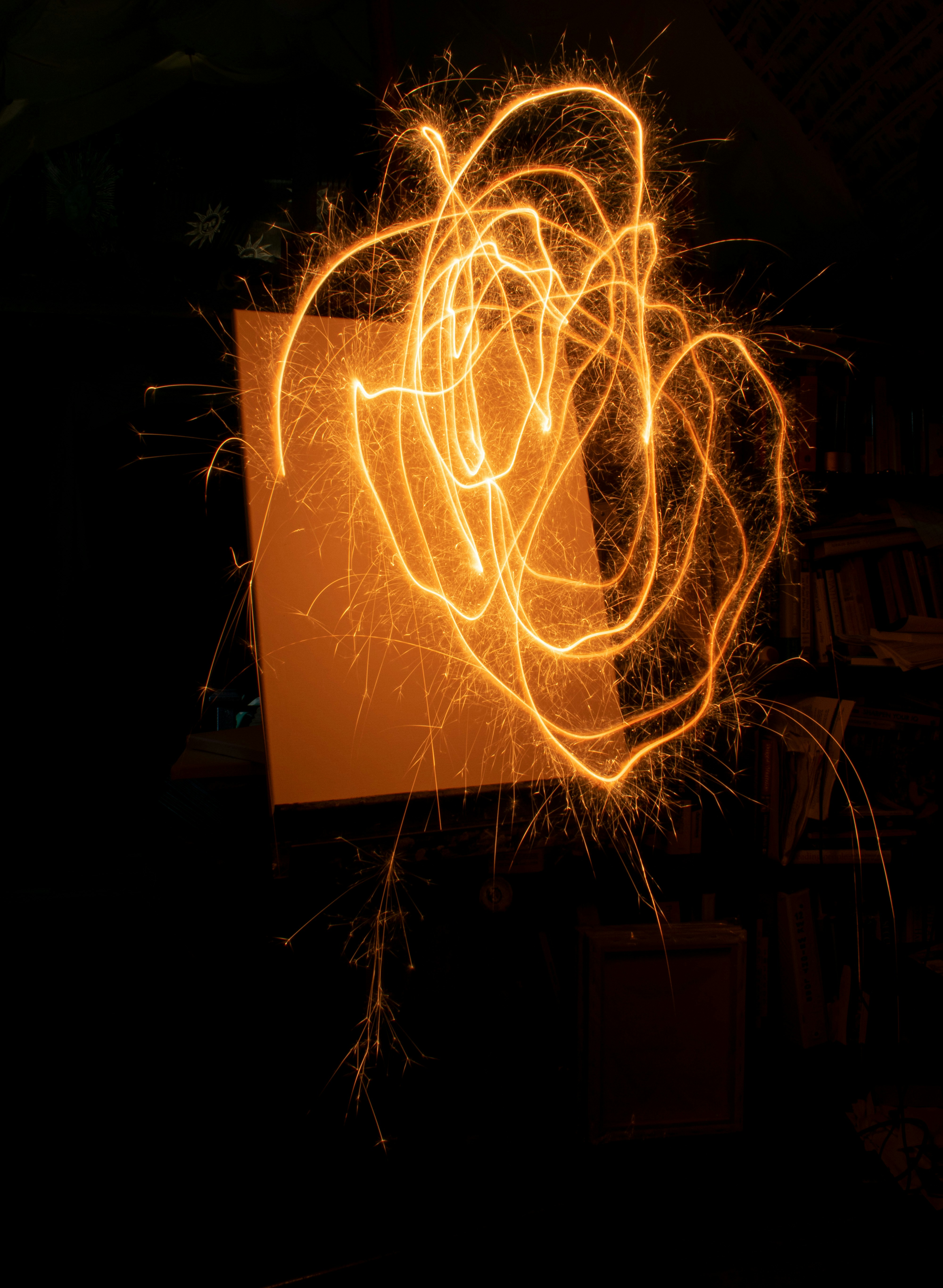 A person holding a lit object in their hand photo – Free Sparkler Image ...