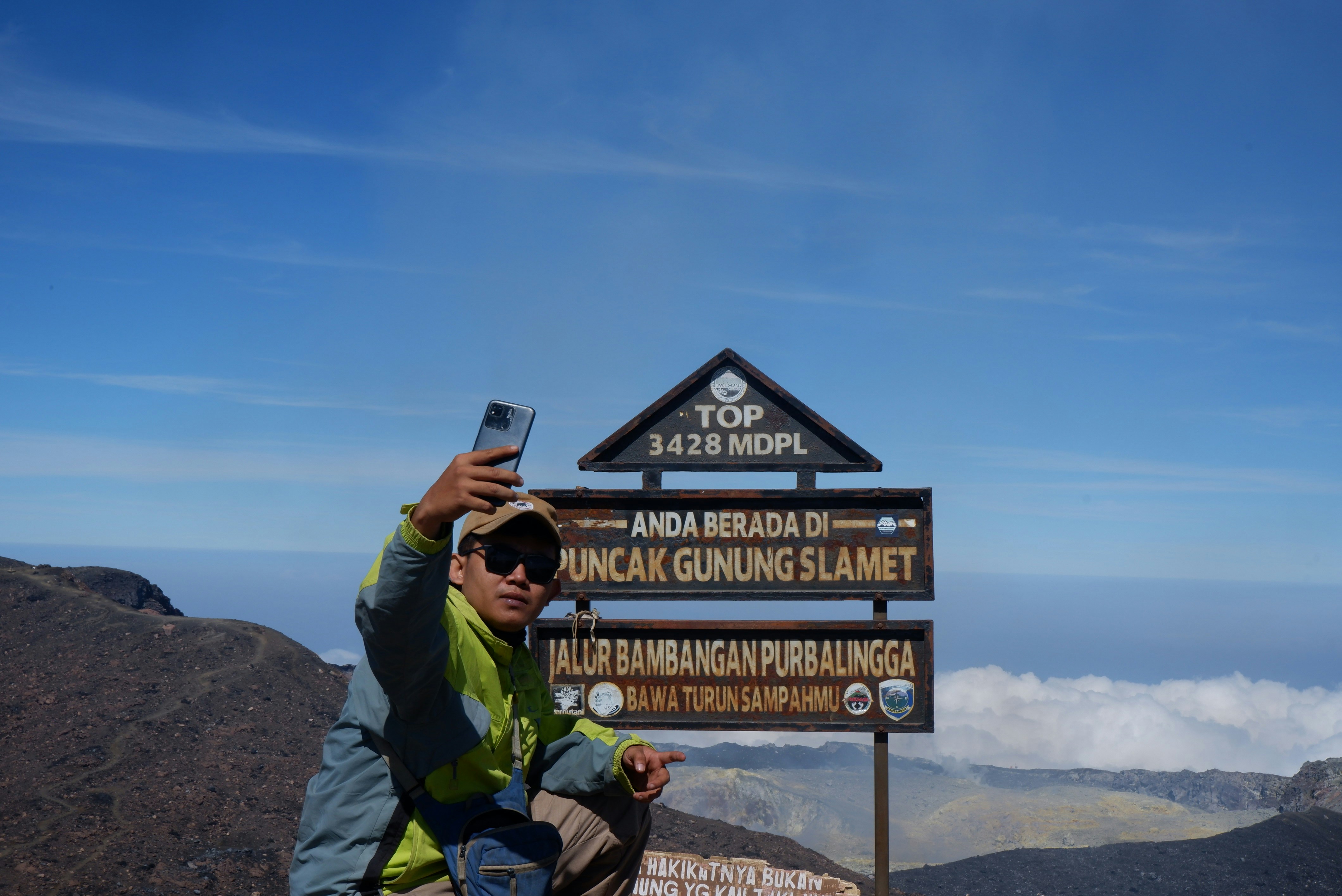 Triumphant Selfie at Mount Slamet's Peak