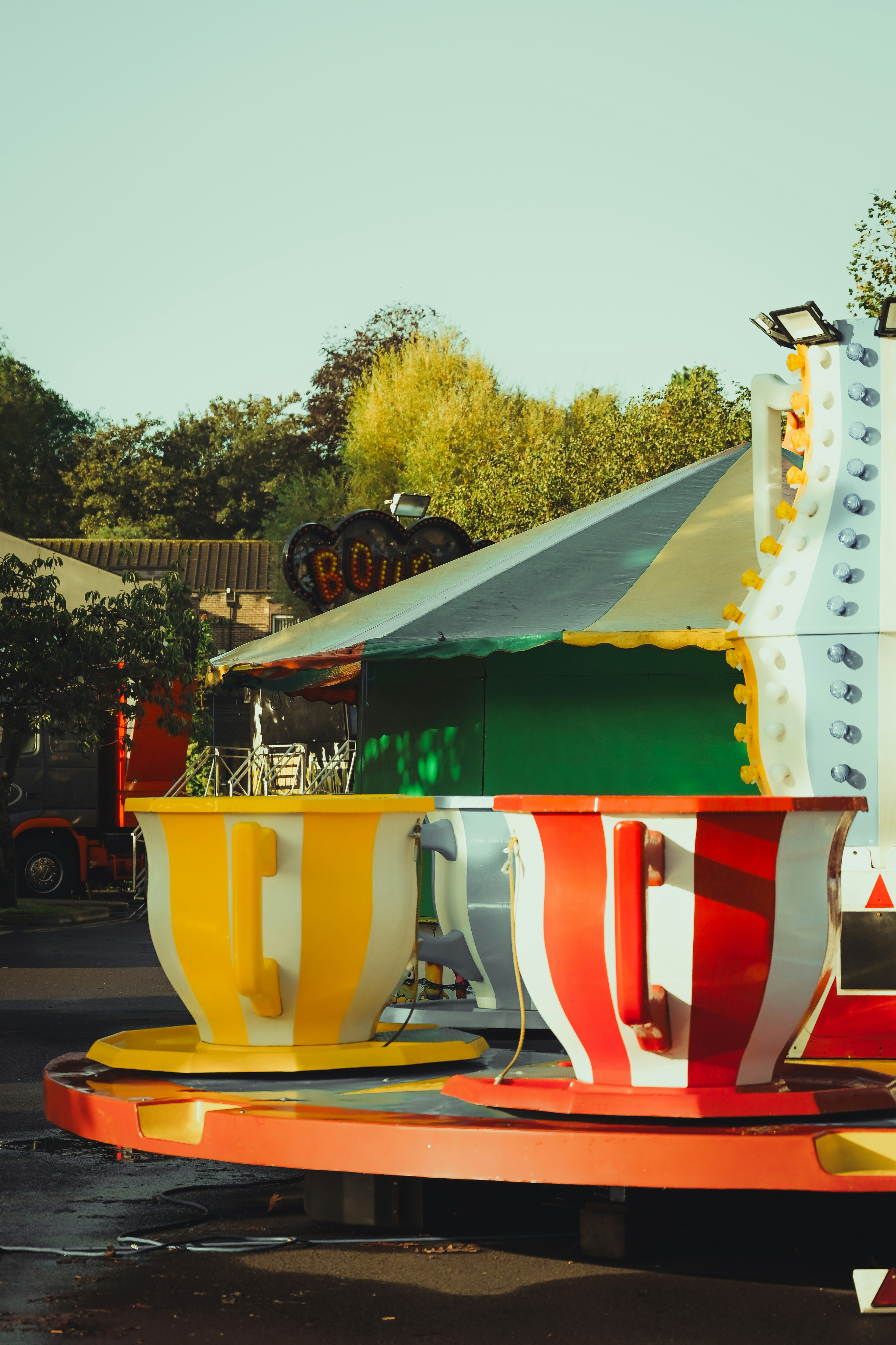 A carnival ride with two large cups on top of it photo – Free Fun fair ...