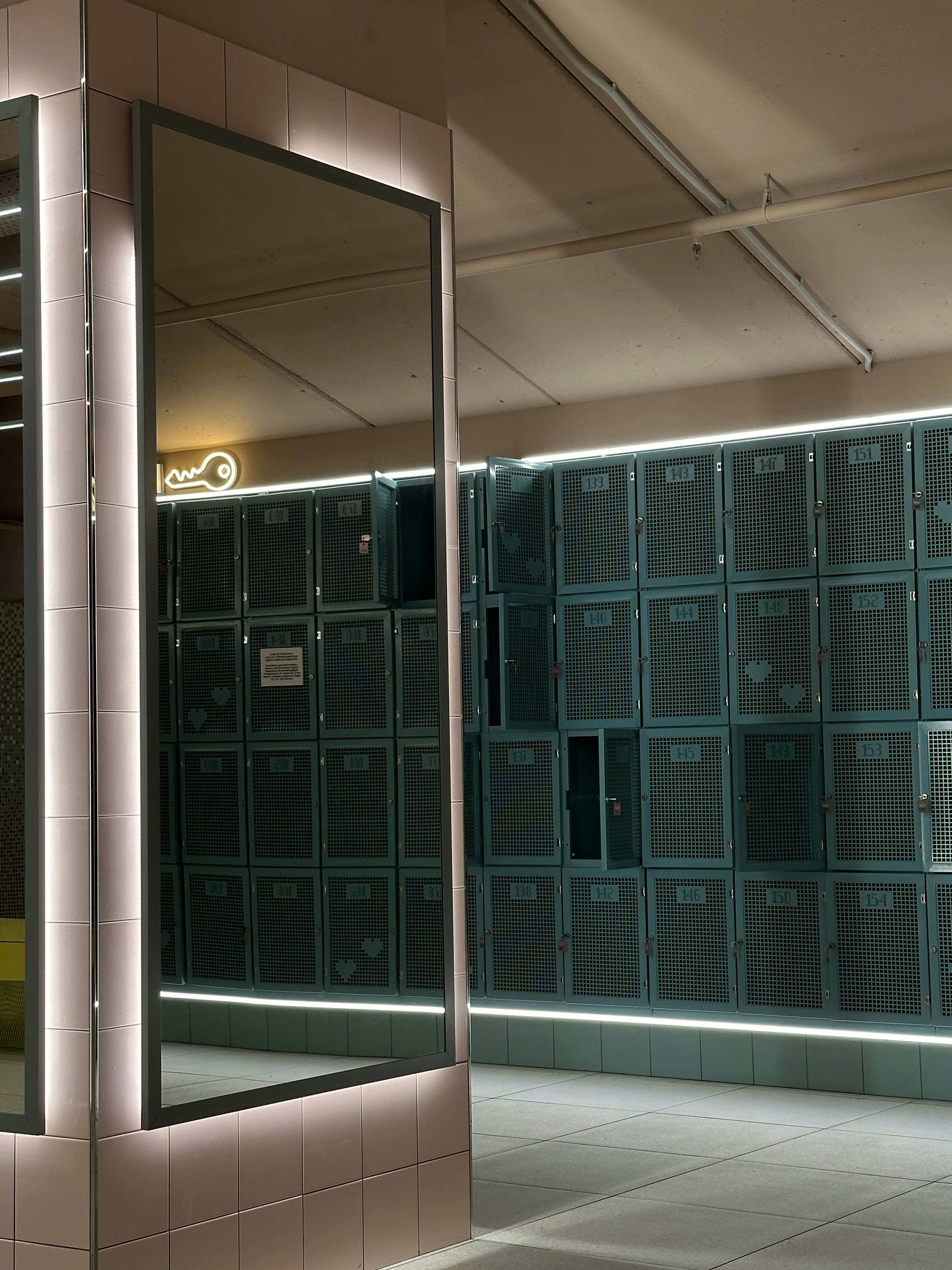 A room with a bunch of lockers in it photo – Free Building Image on ...