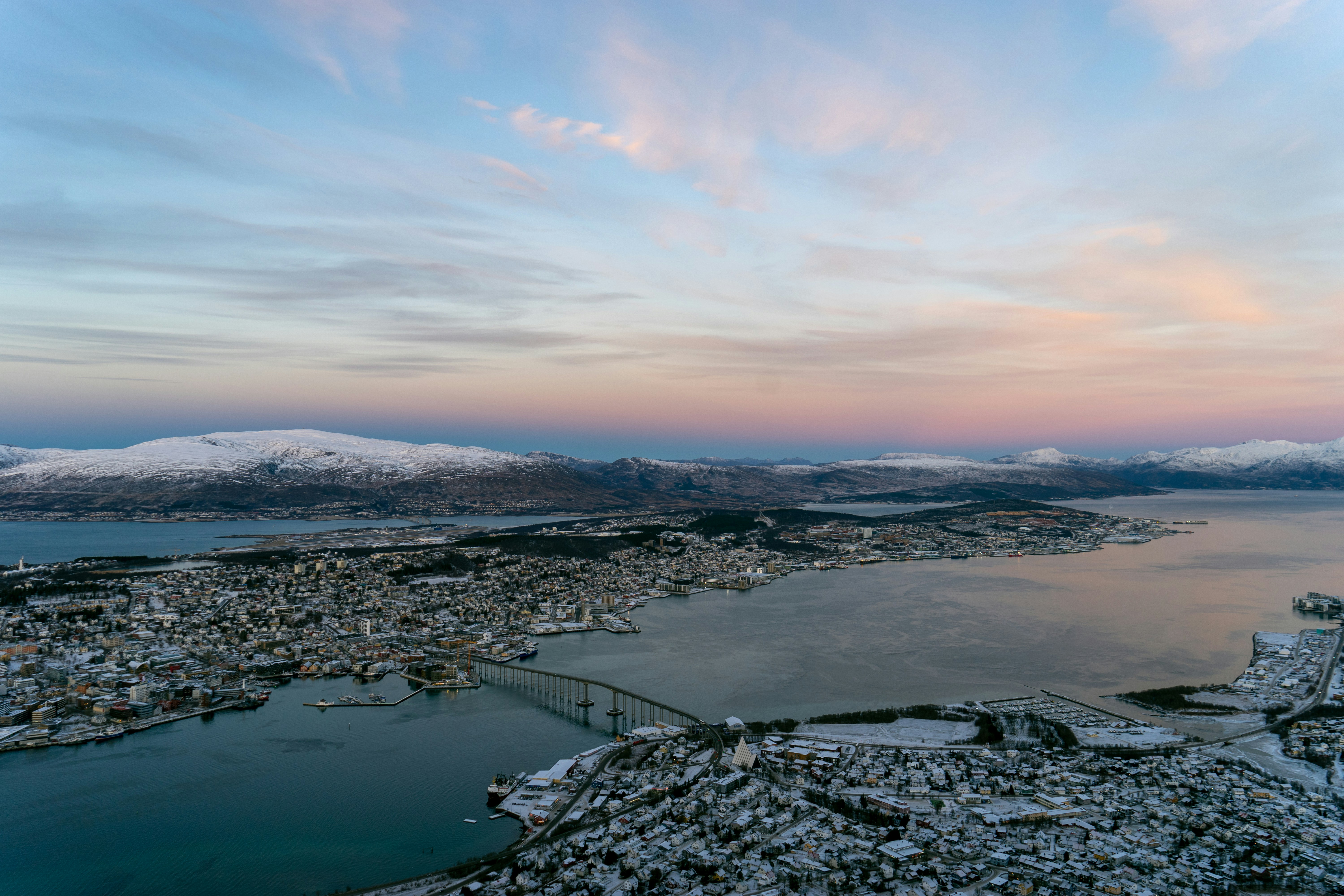 Snowbound Fjord Harbor at Dawn: Distant Mountains Framing a Quiet Nordic Port