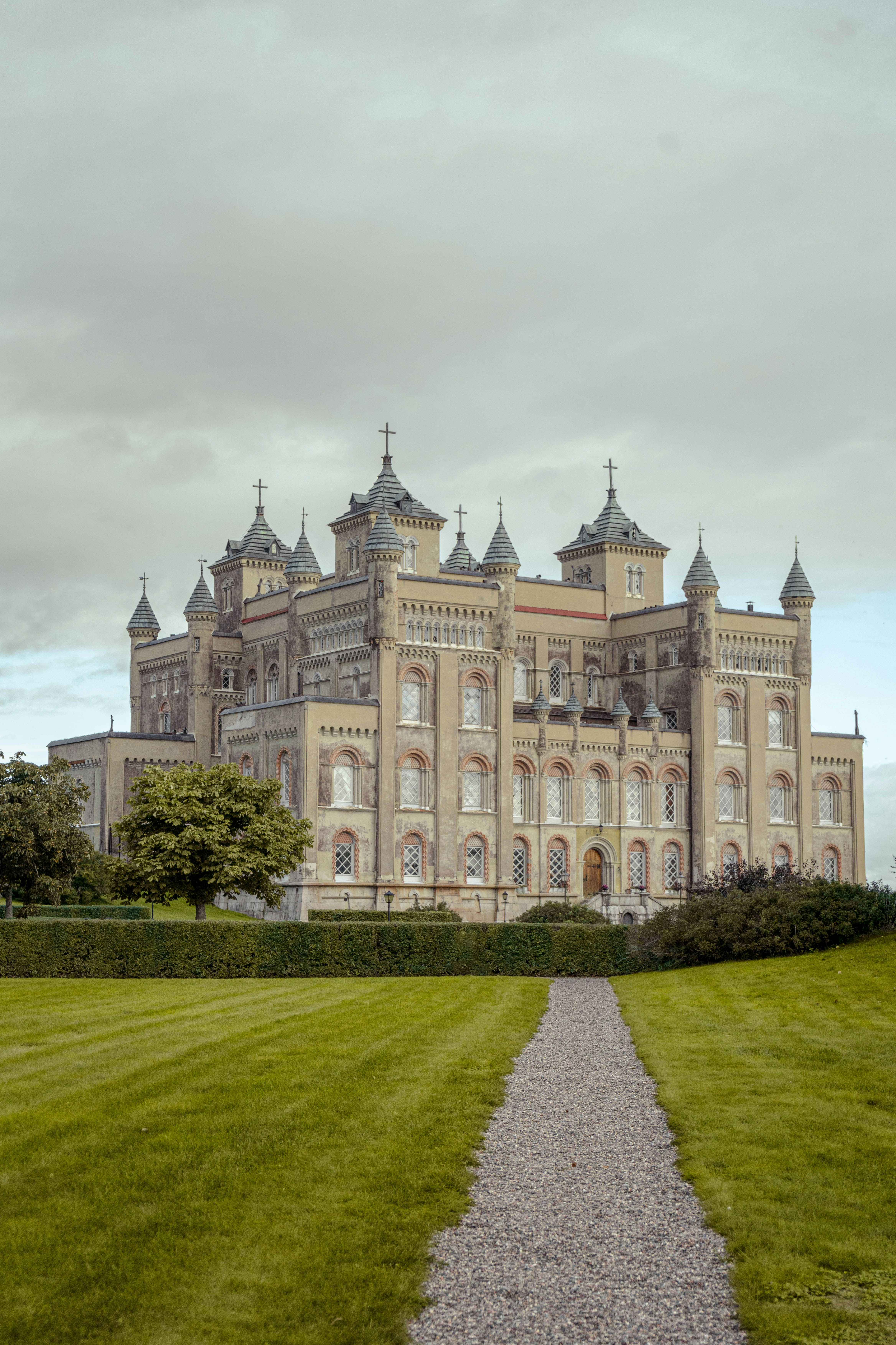 A large building with a long pathway leading to it photo – Free Castle ...