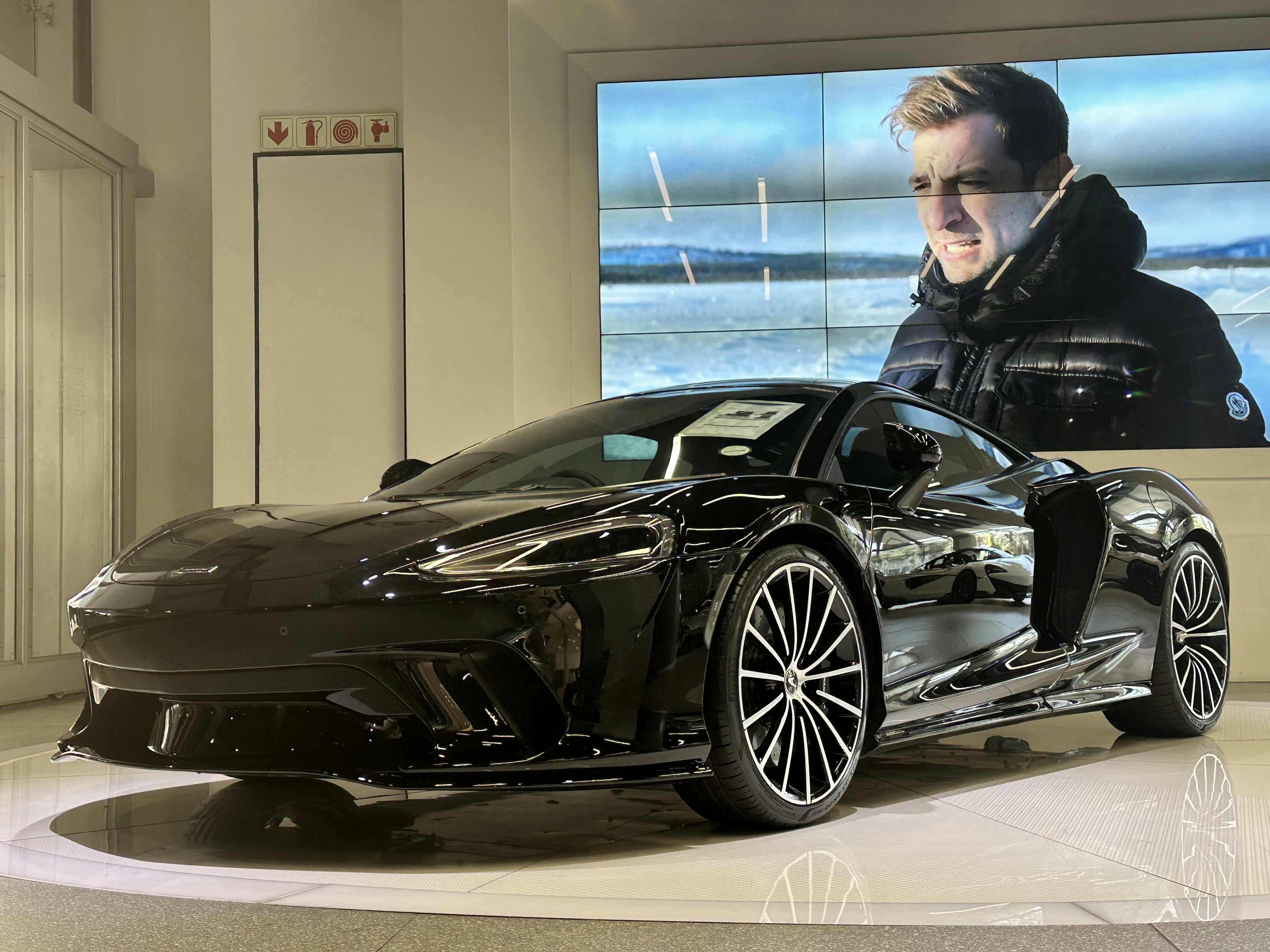 A black sports car on display in a building photo – Free Melrose arch ...