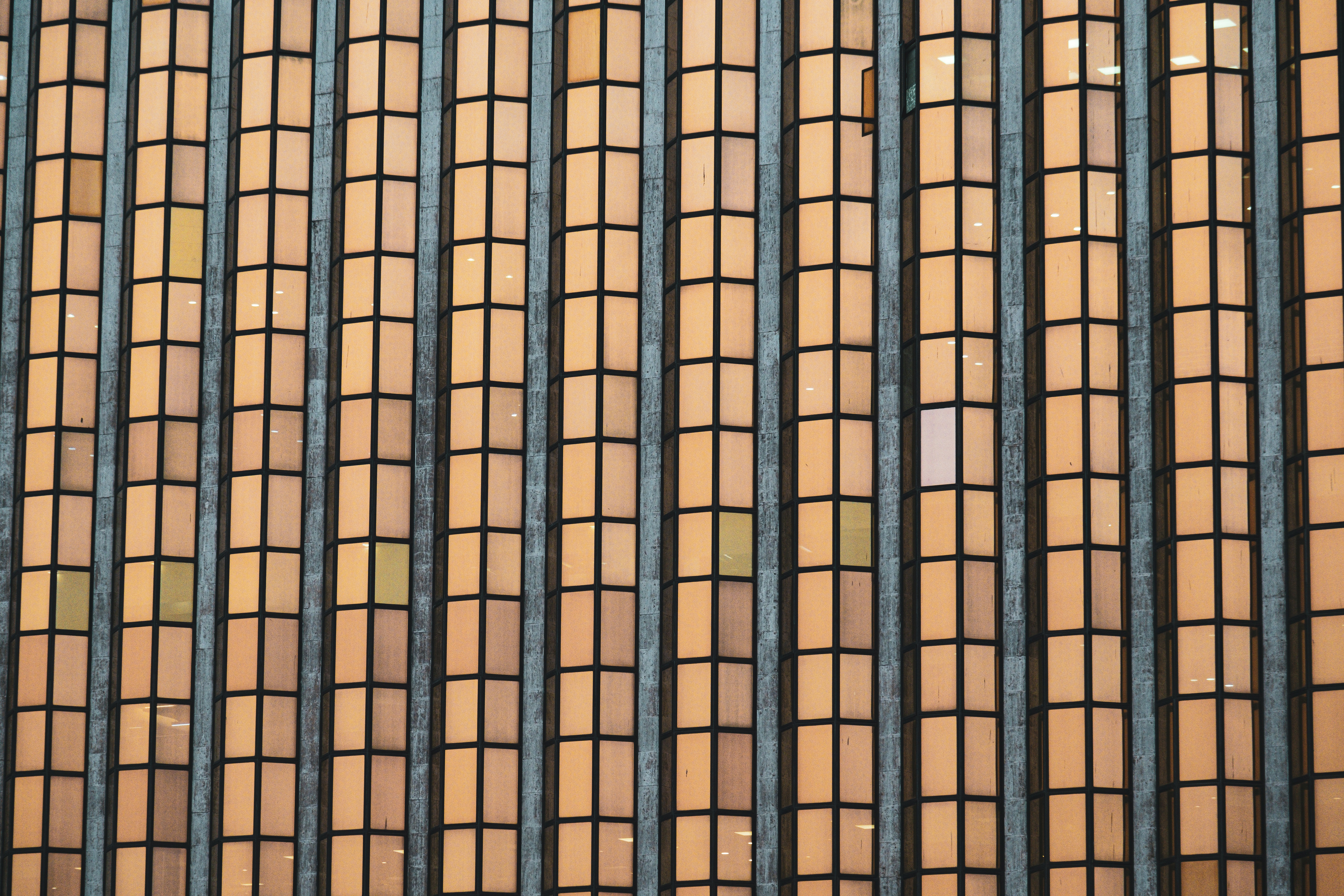 Ember Grid: Vertical Glass Loom on a City Facade
