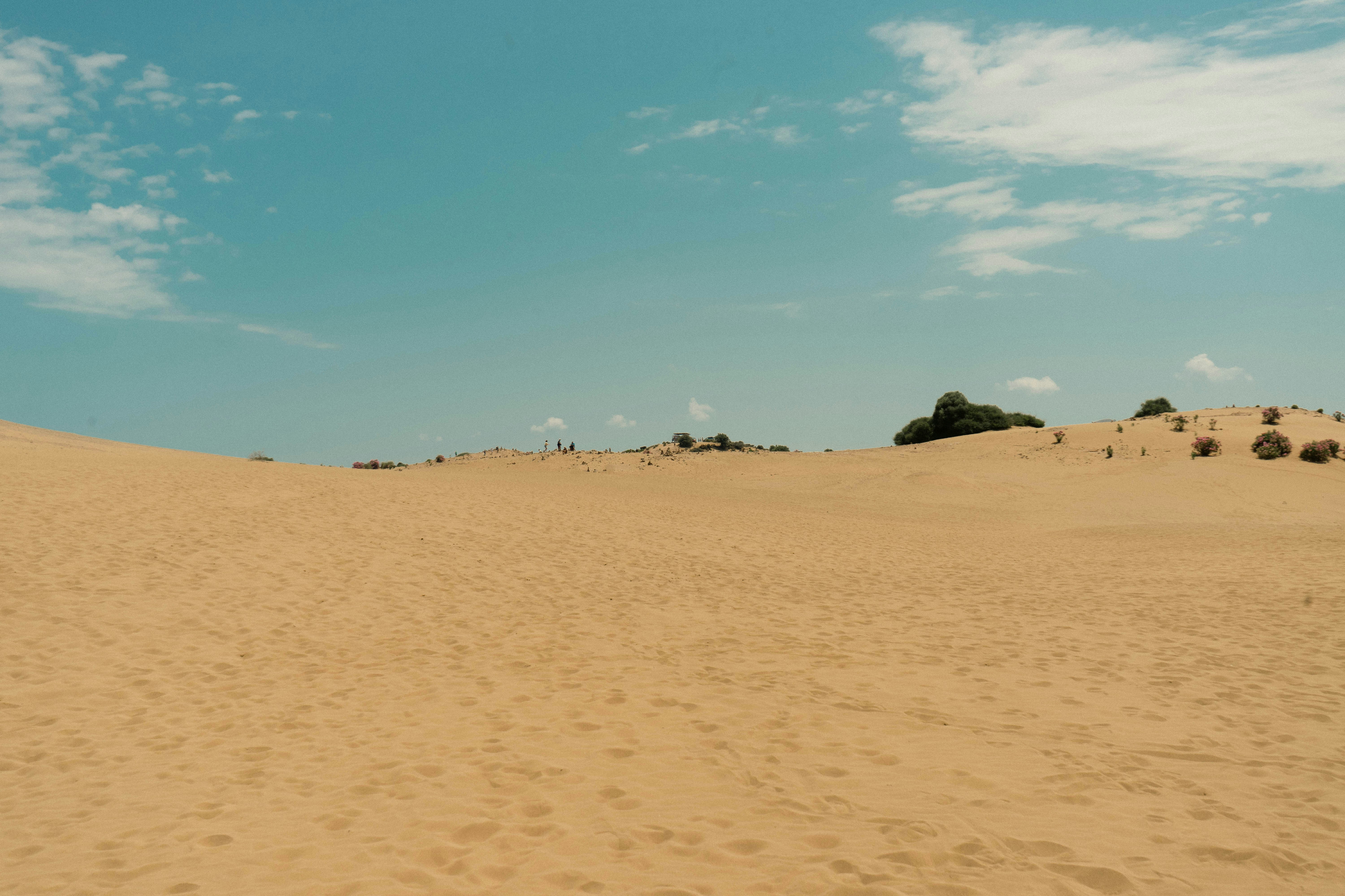 A sandy area with footprints in the sand photo – Free European desert ...