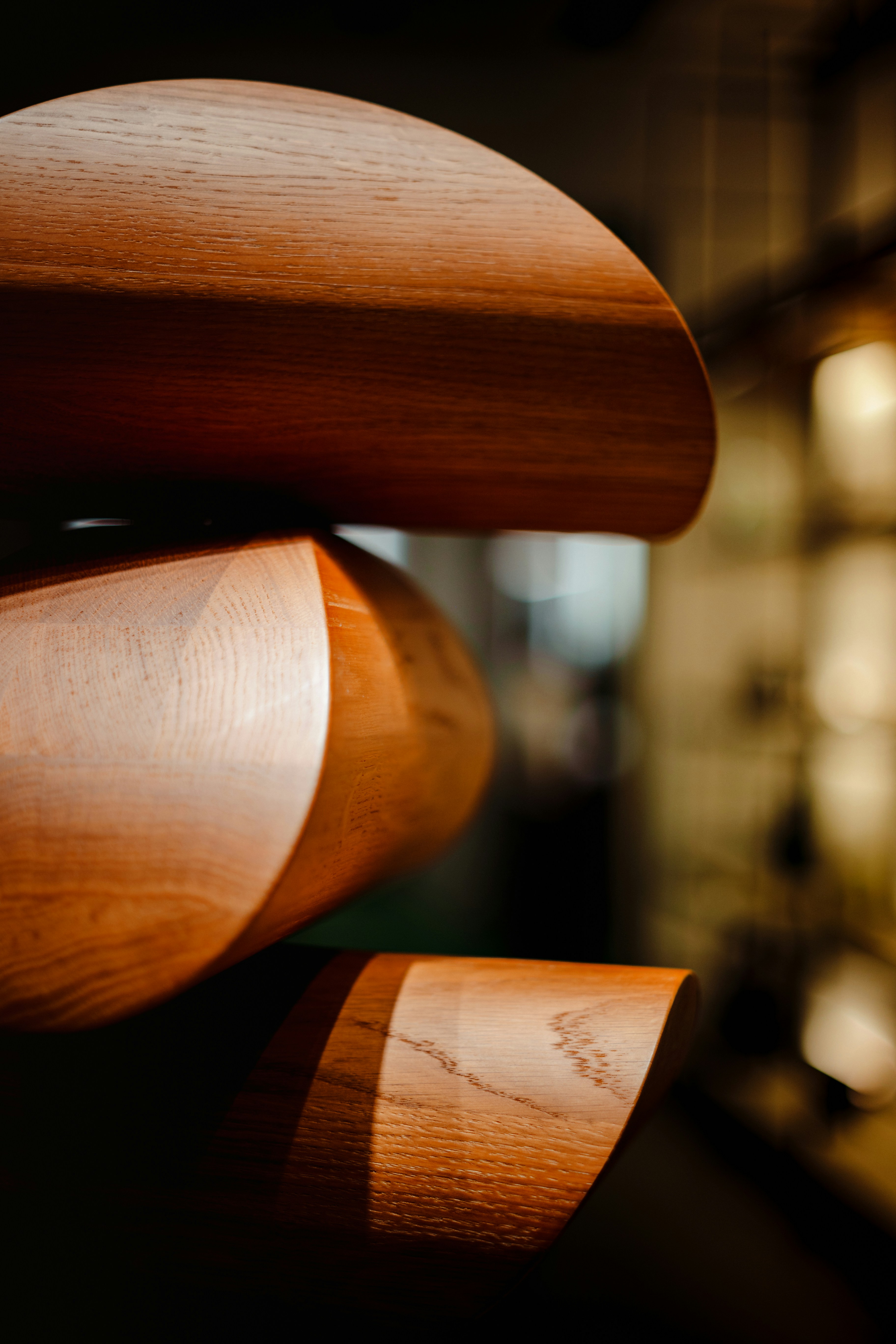 a close up of a wooden object with a blurry background