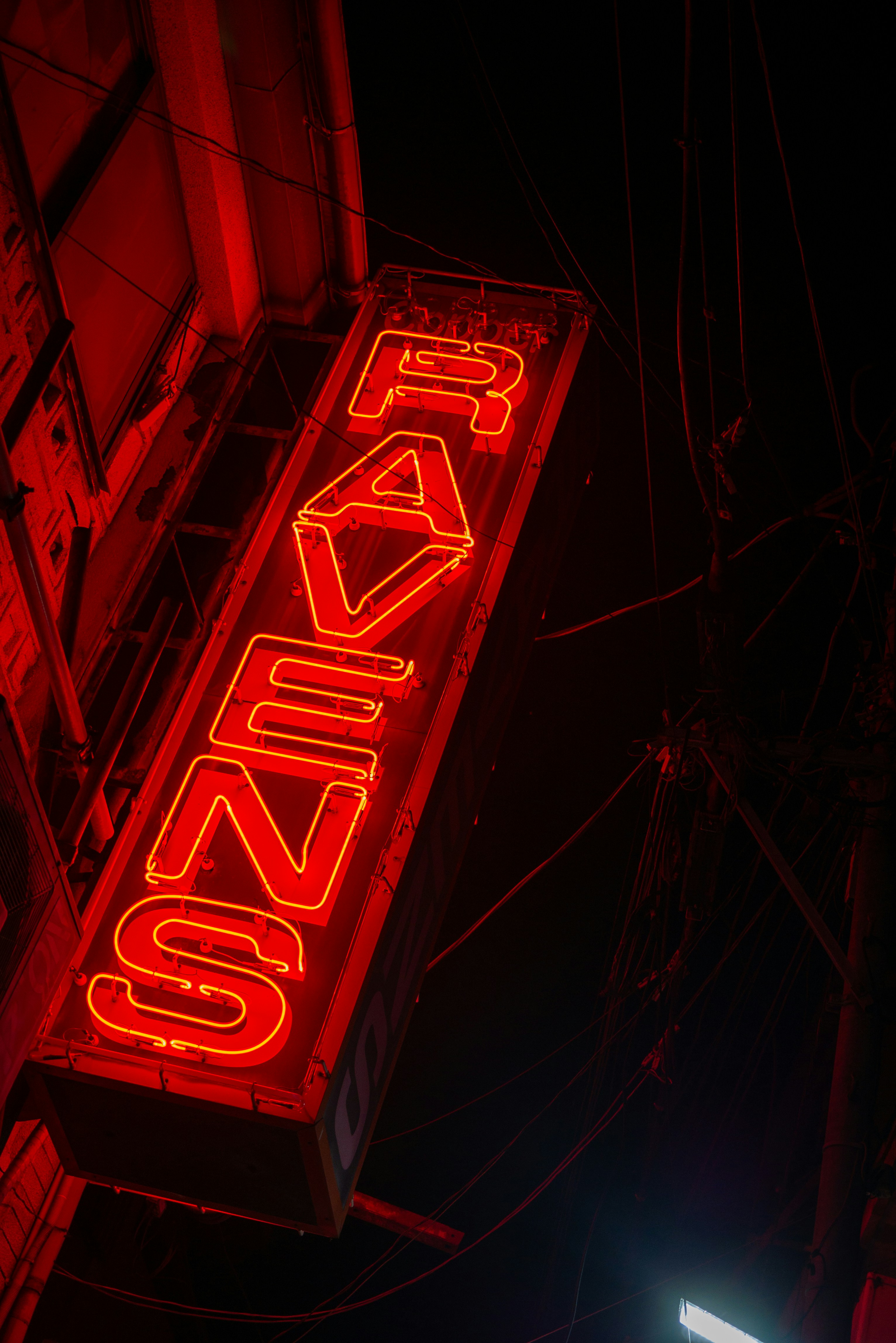 Neon Outpost: Red Glow on a Midnight Sign
