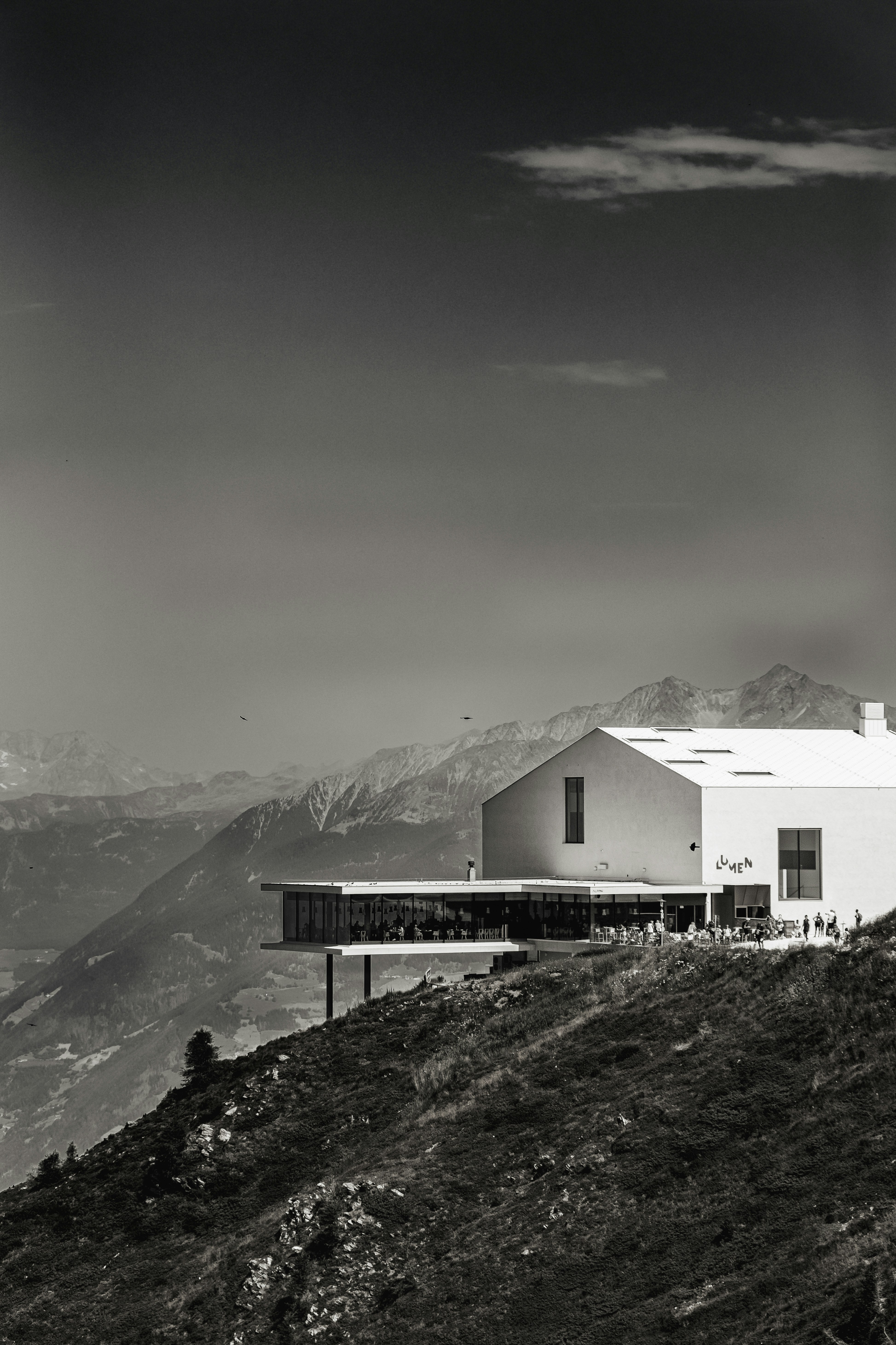 Terrace Above the Void: A Cliffside Alpine Lodge