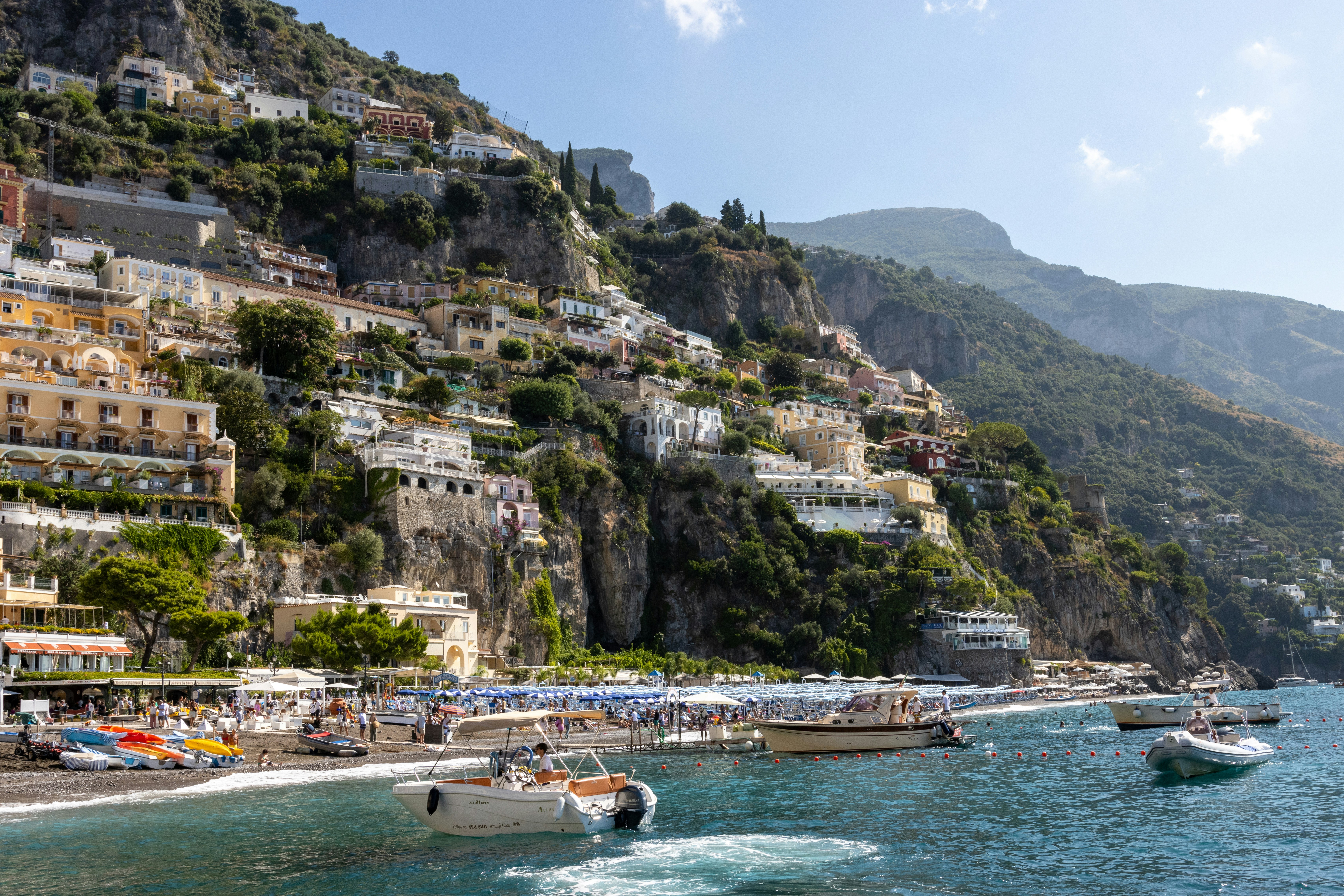 A group of boats floating on top of a body of water photo – Free ...