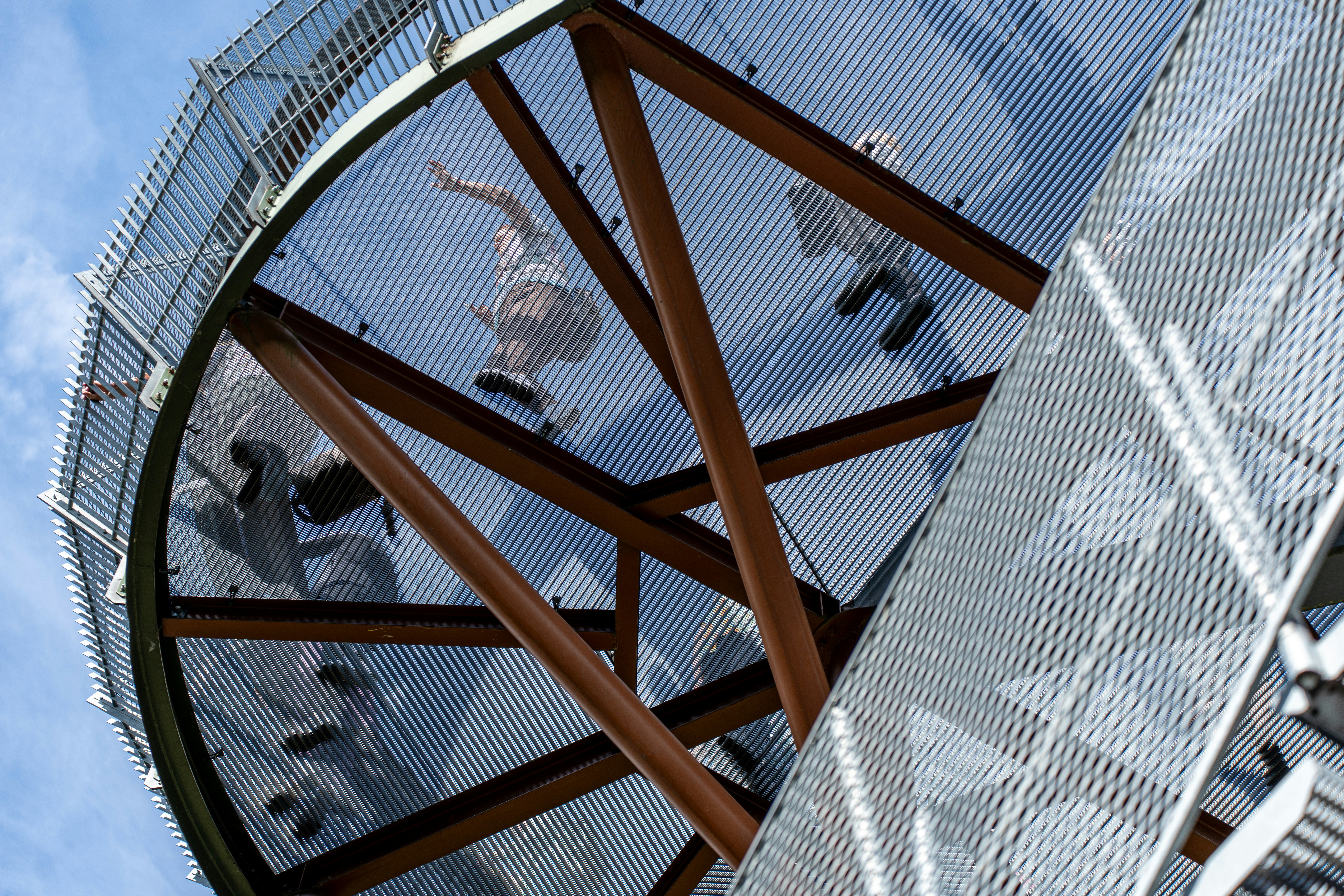 a man standing on top of a metal structure