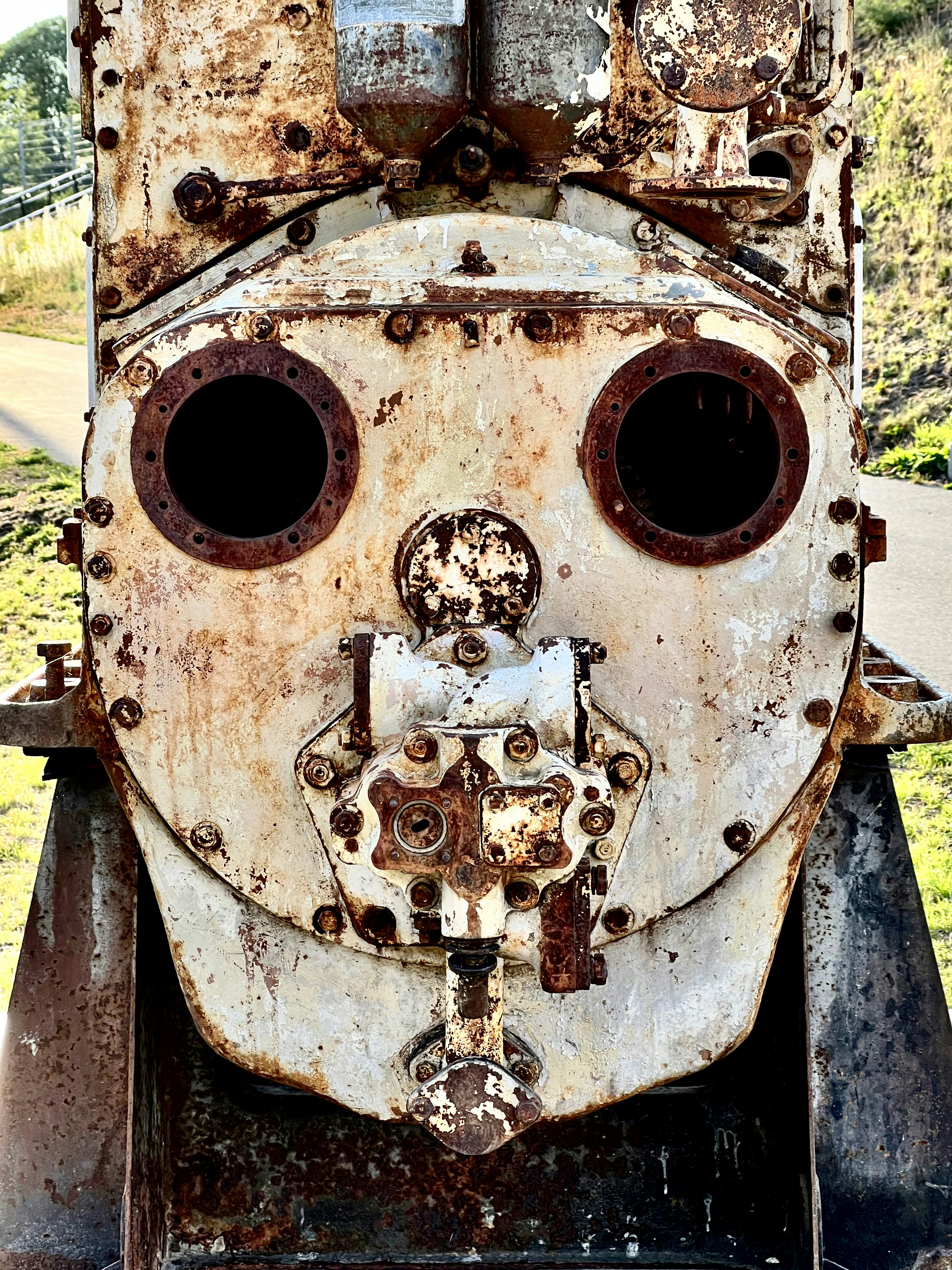 Rusting Sentinel: A Close-Up of a Weathered Industrial Face