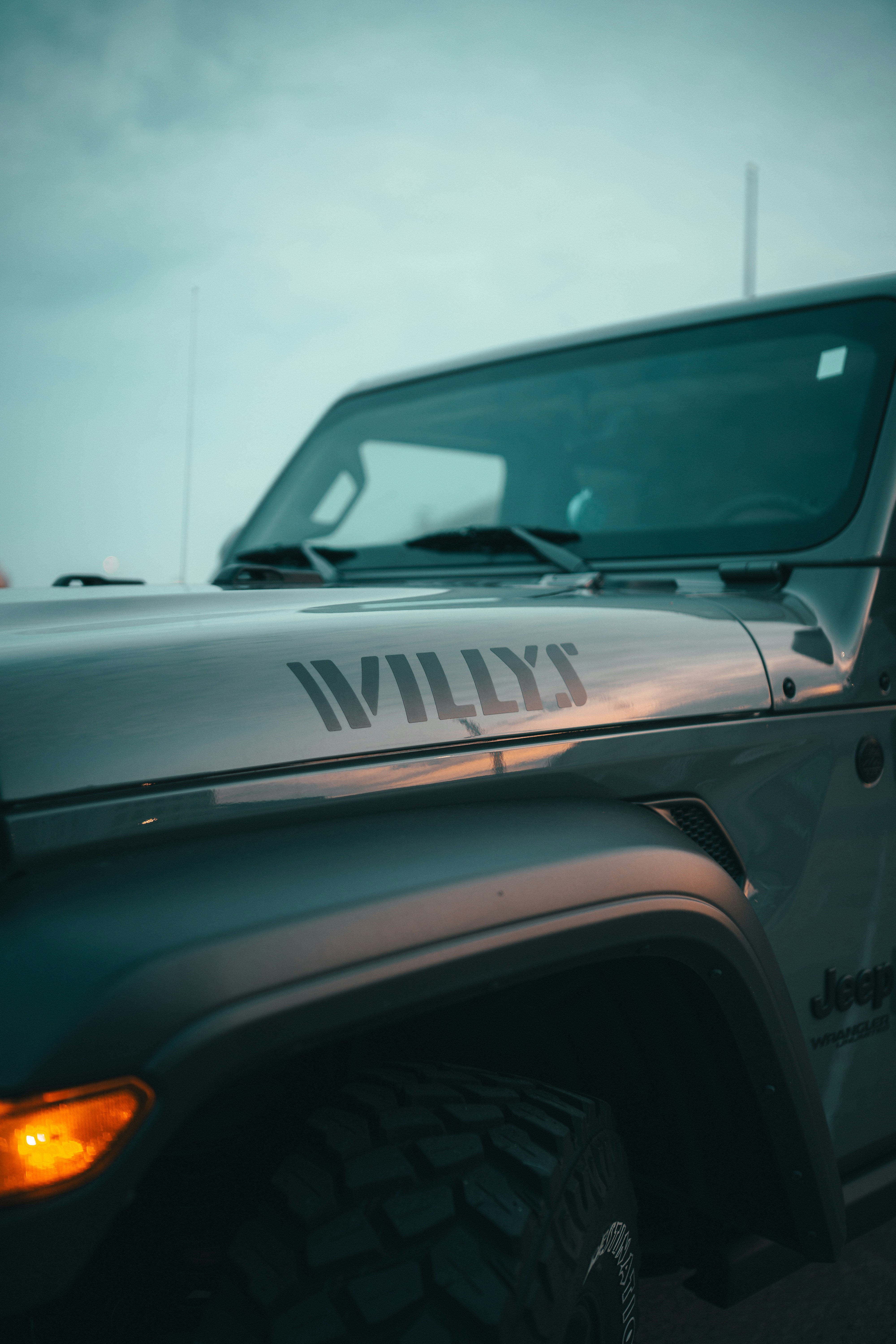 Willys on Teal Horizon: A Jeep’s Quiet Strength