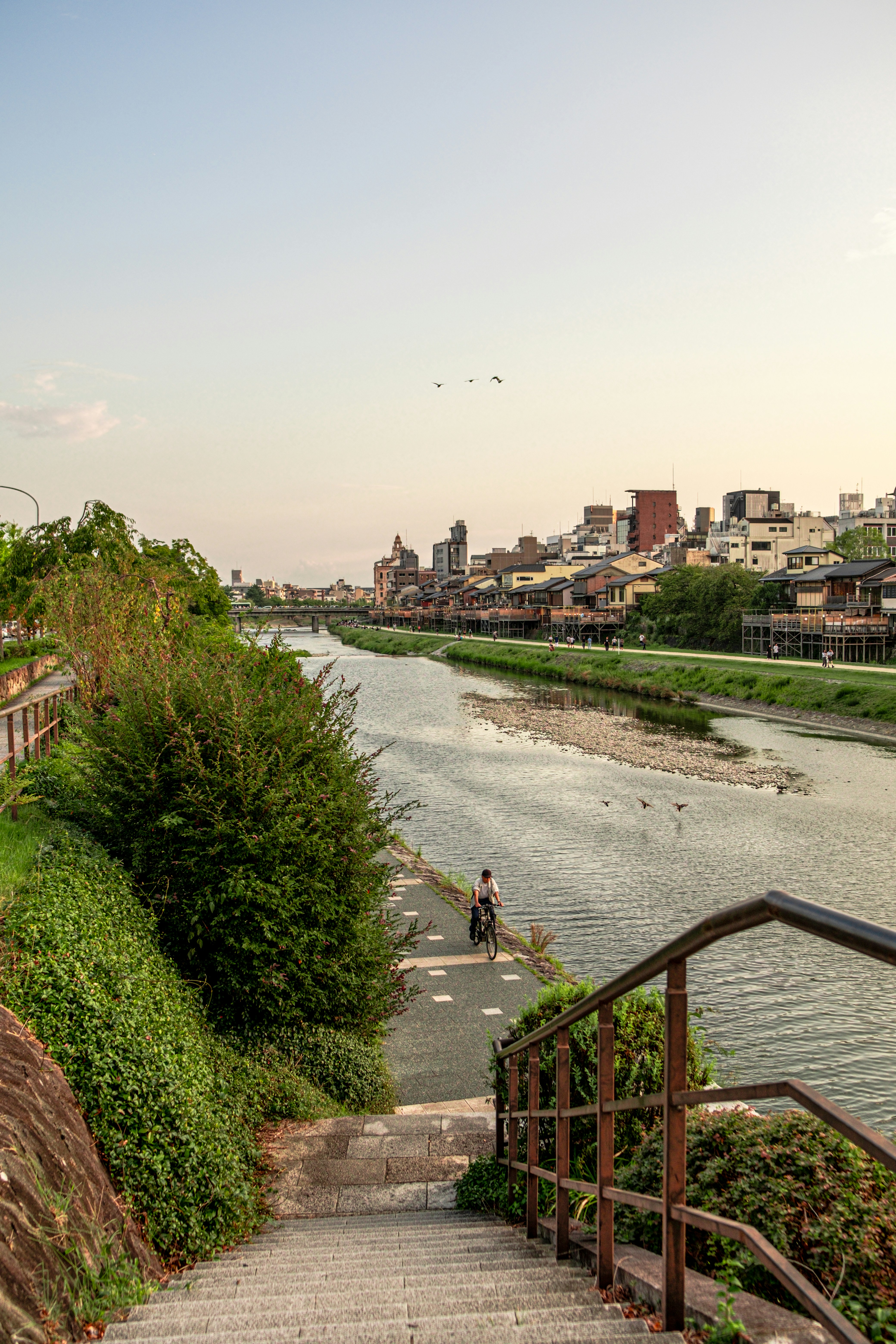 Riverside Staircase: Quiet Path Toward a Distant Town