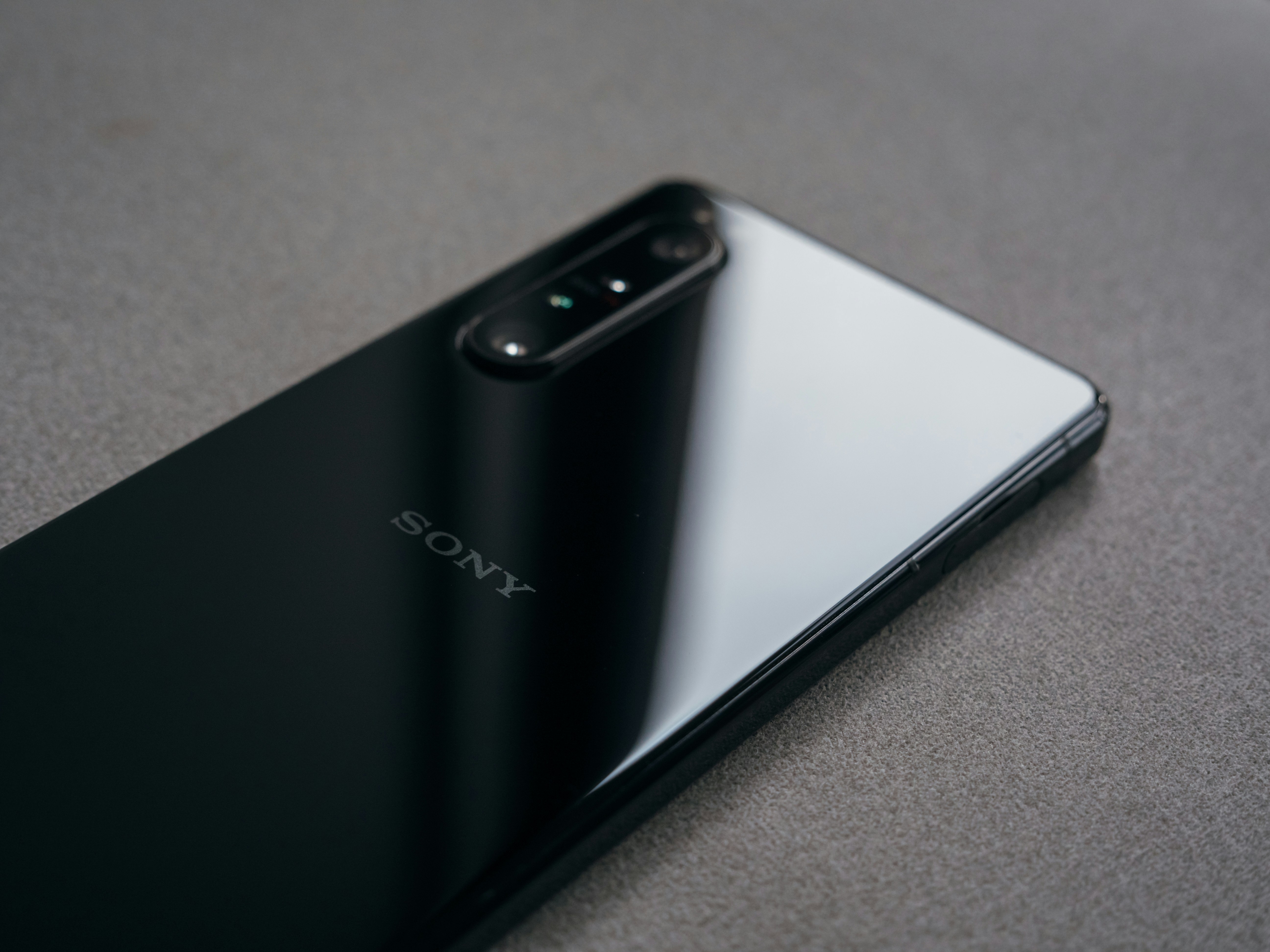 A close up of the back of a black sony phone photo – Free Phone Image ...