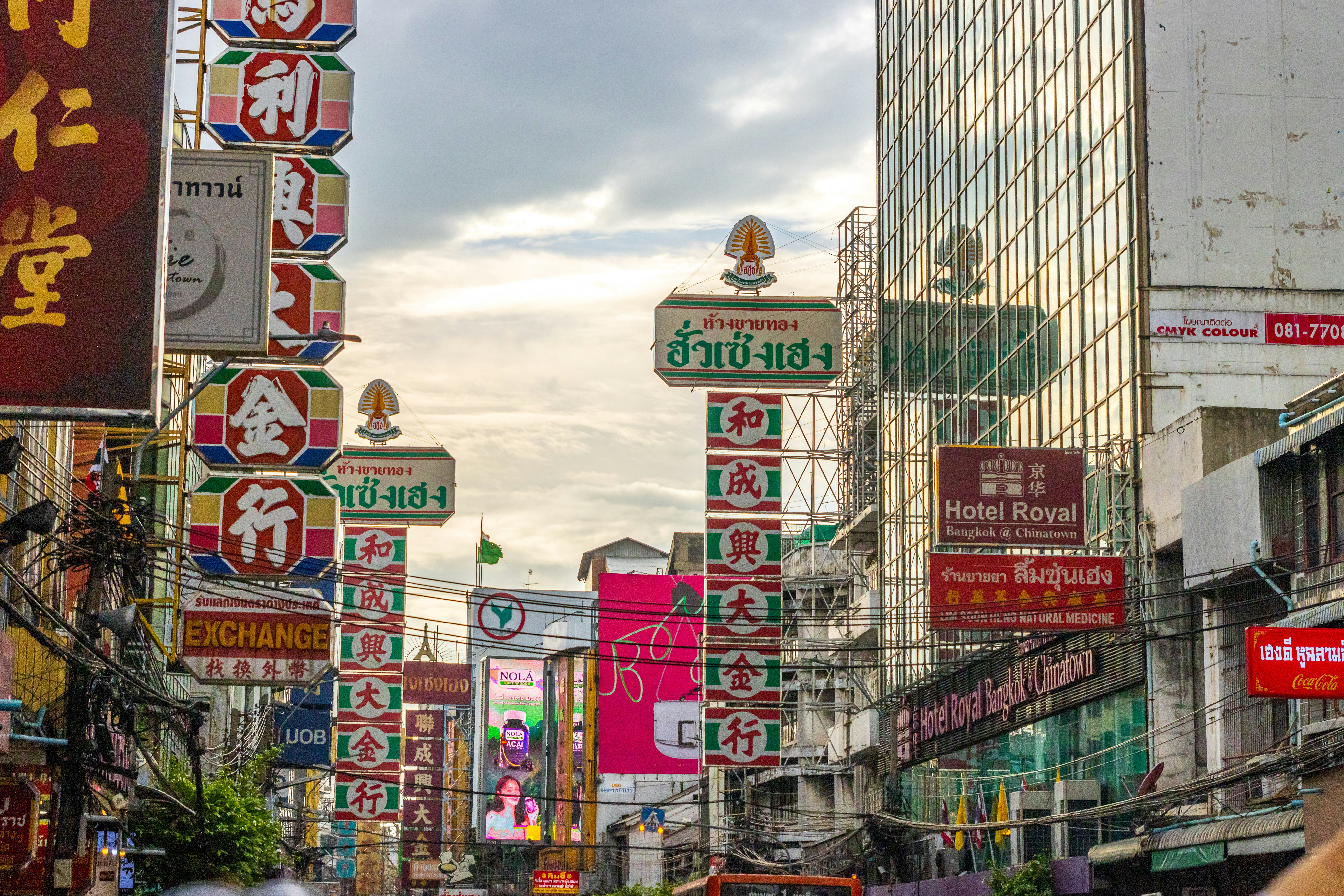 A city street filled with lots of signs photo – Free Building Image on ...