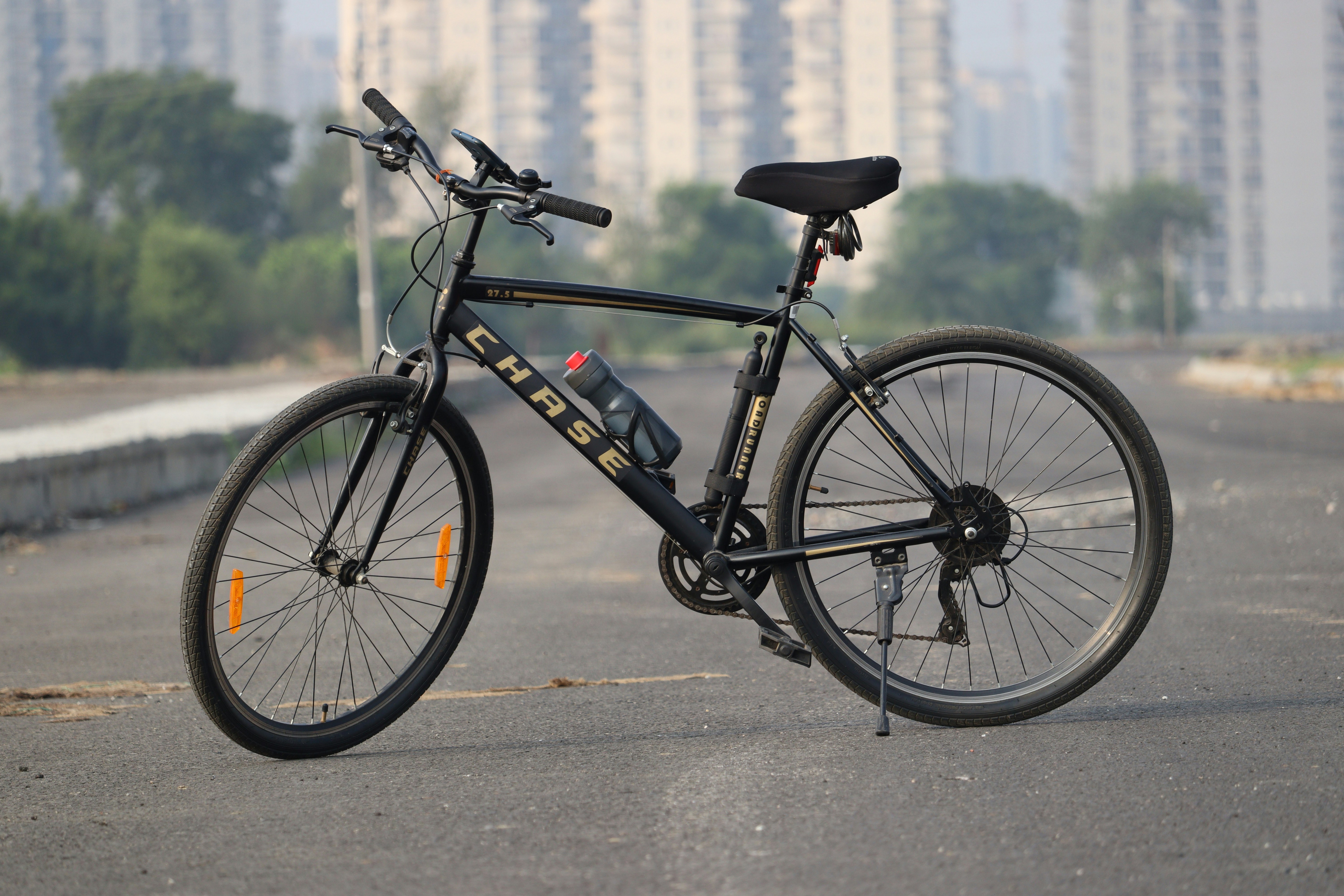 Urban Commuter in Focus: Black Hybrid Bike on a Quiet Concrete Stage