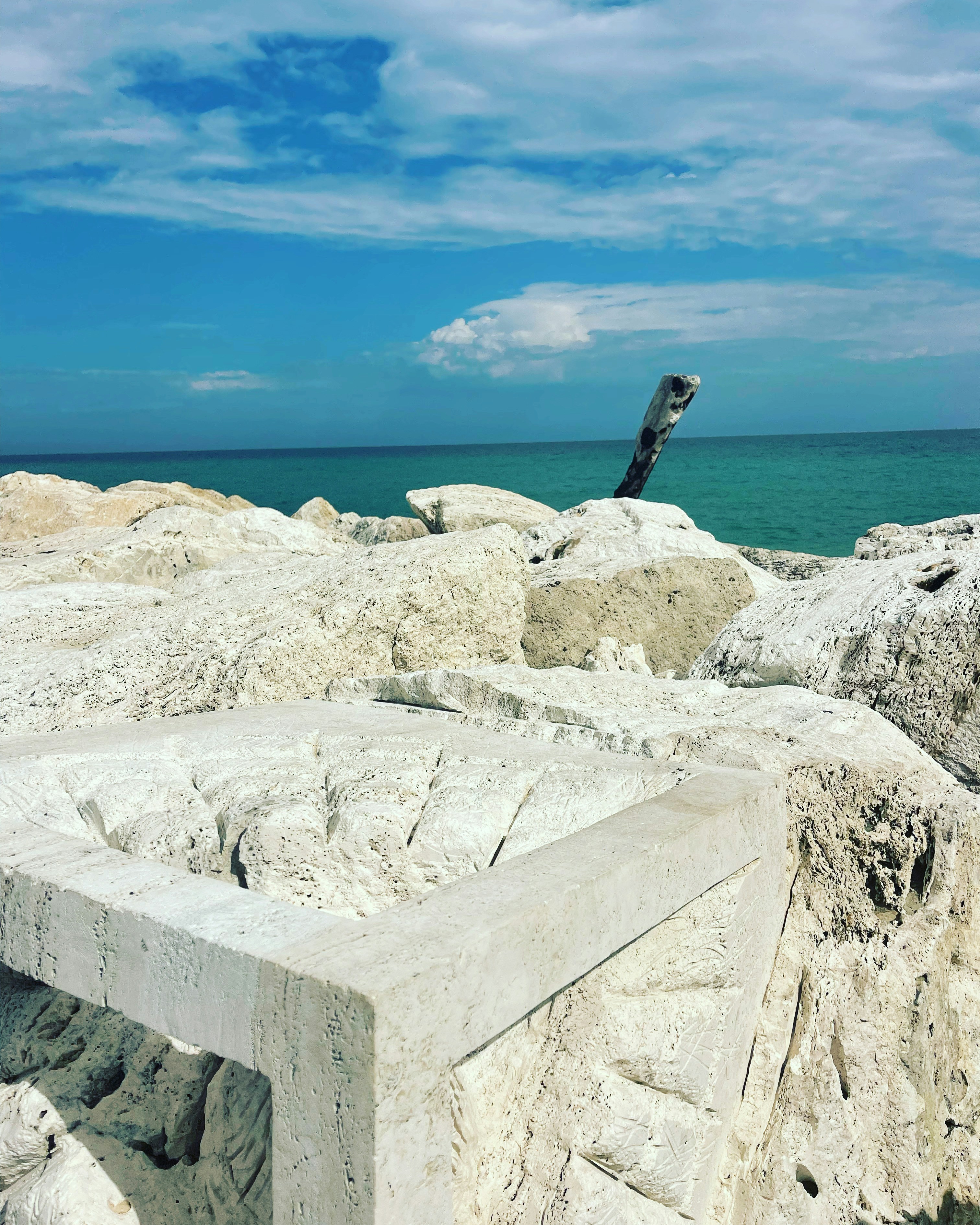 Stone Breakwater Reaching Toward an Open Sea