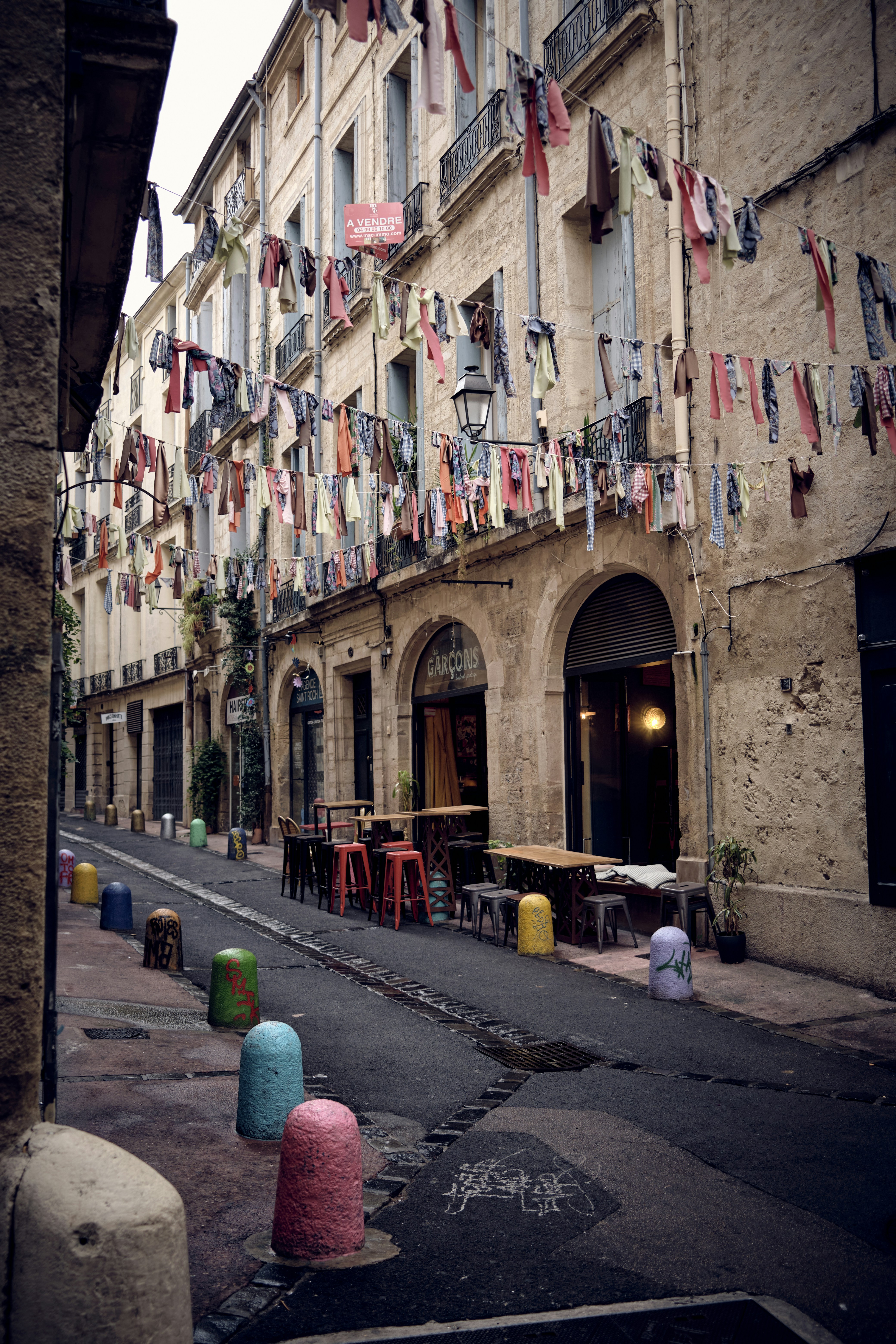 Laundry Lines and Warm Café Arches: A Quiet Street Tale