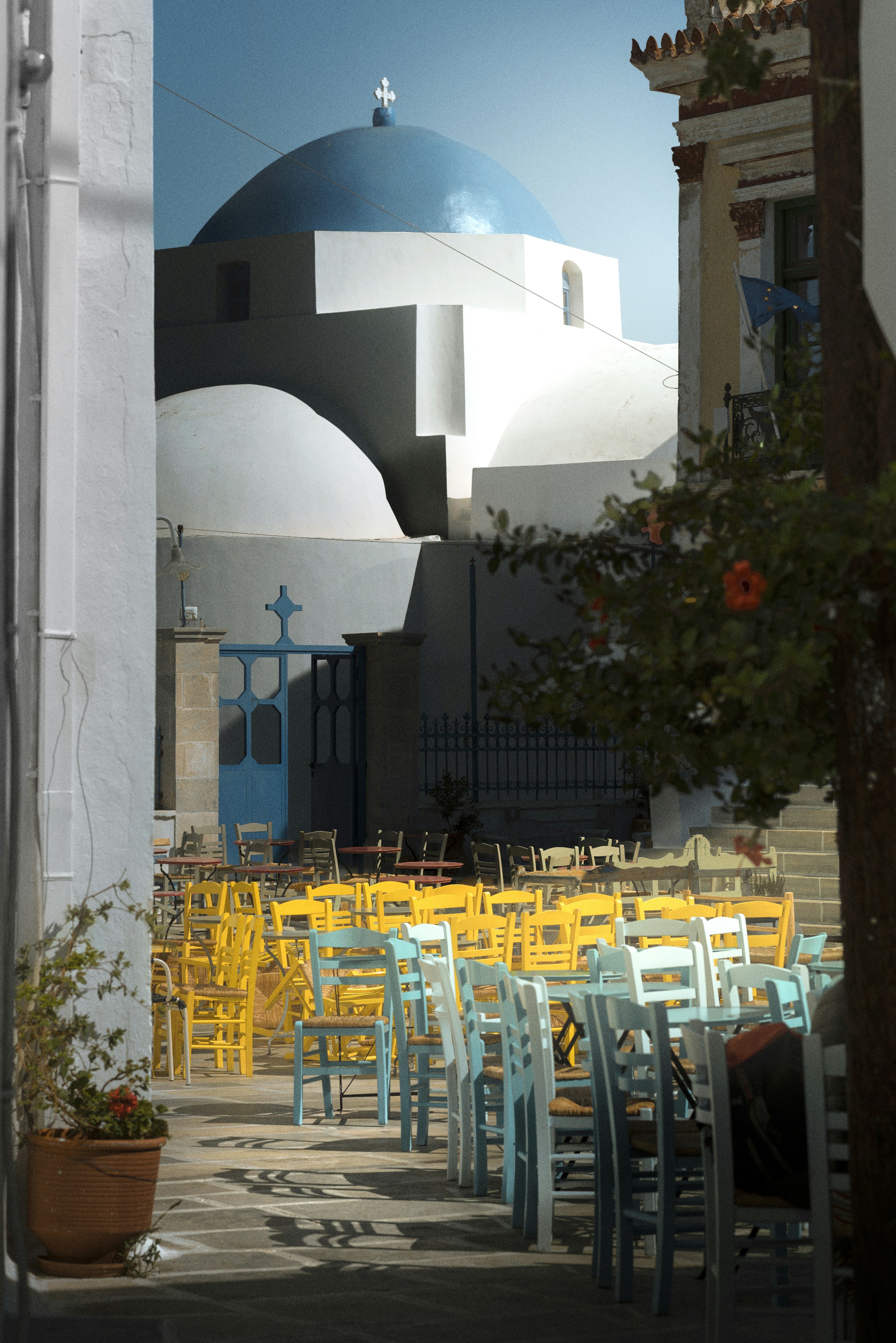 Blue Dome and Sunlit Courtyard: A Greek Island Sit-in