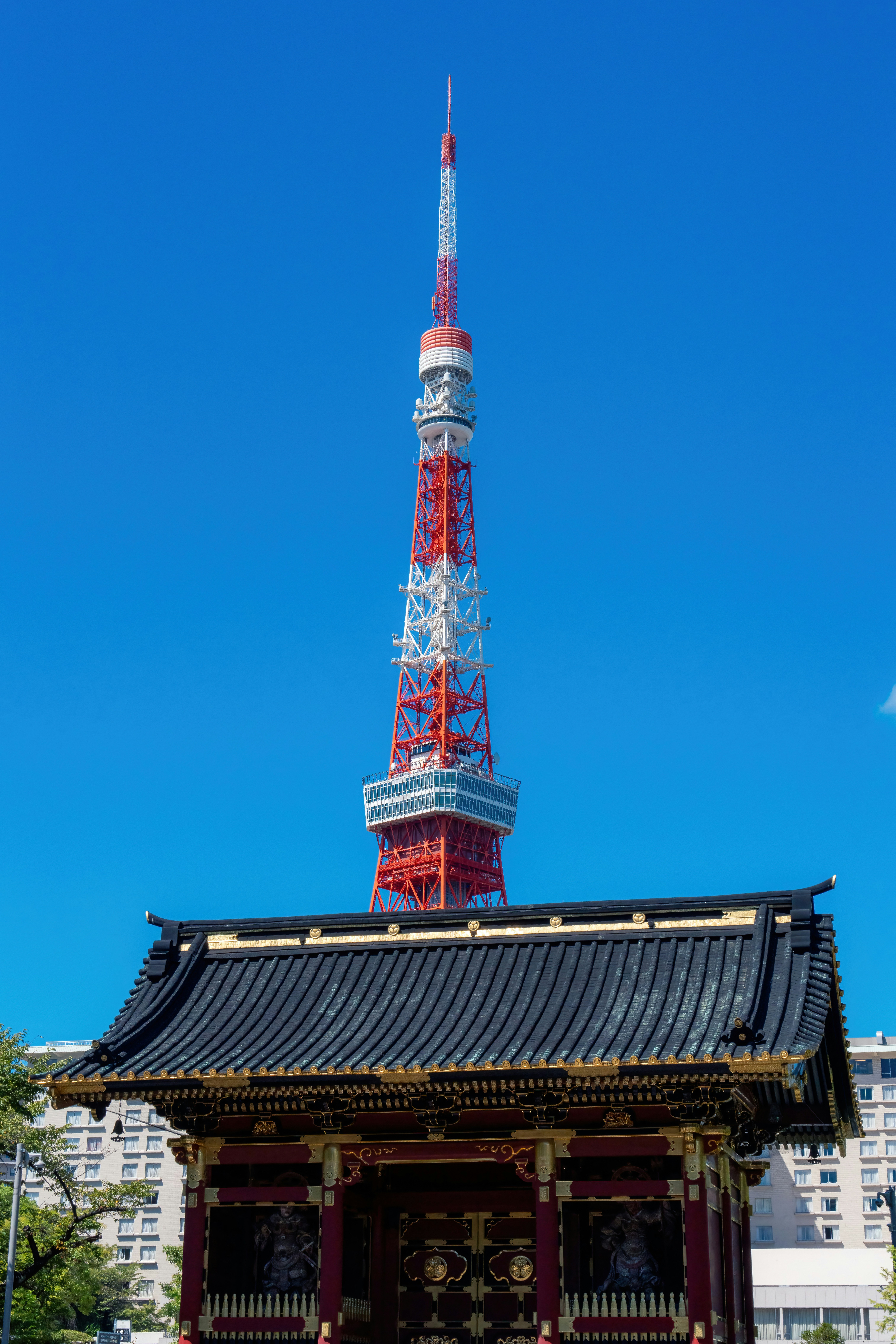 A red and white tower on top of a building photo – Free Tokyo tower ...