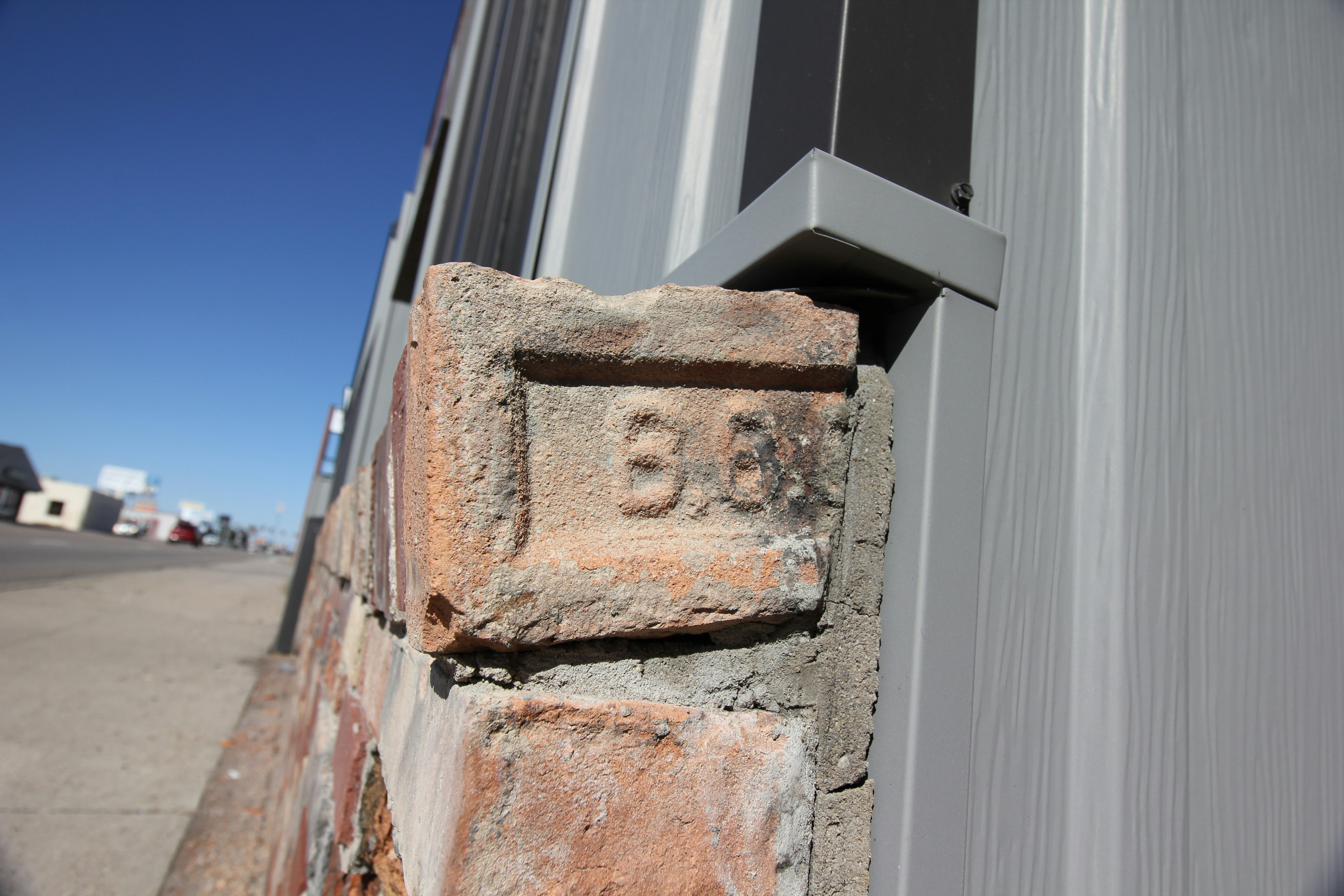 A close up of a brick on the side of a building photo – Free Brick ...
