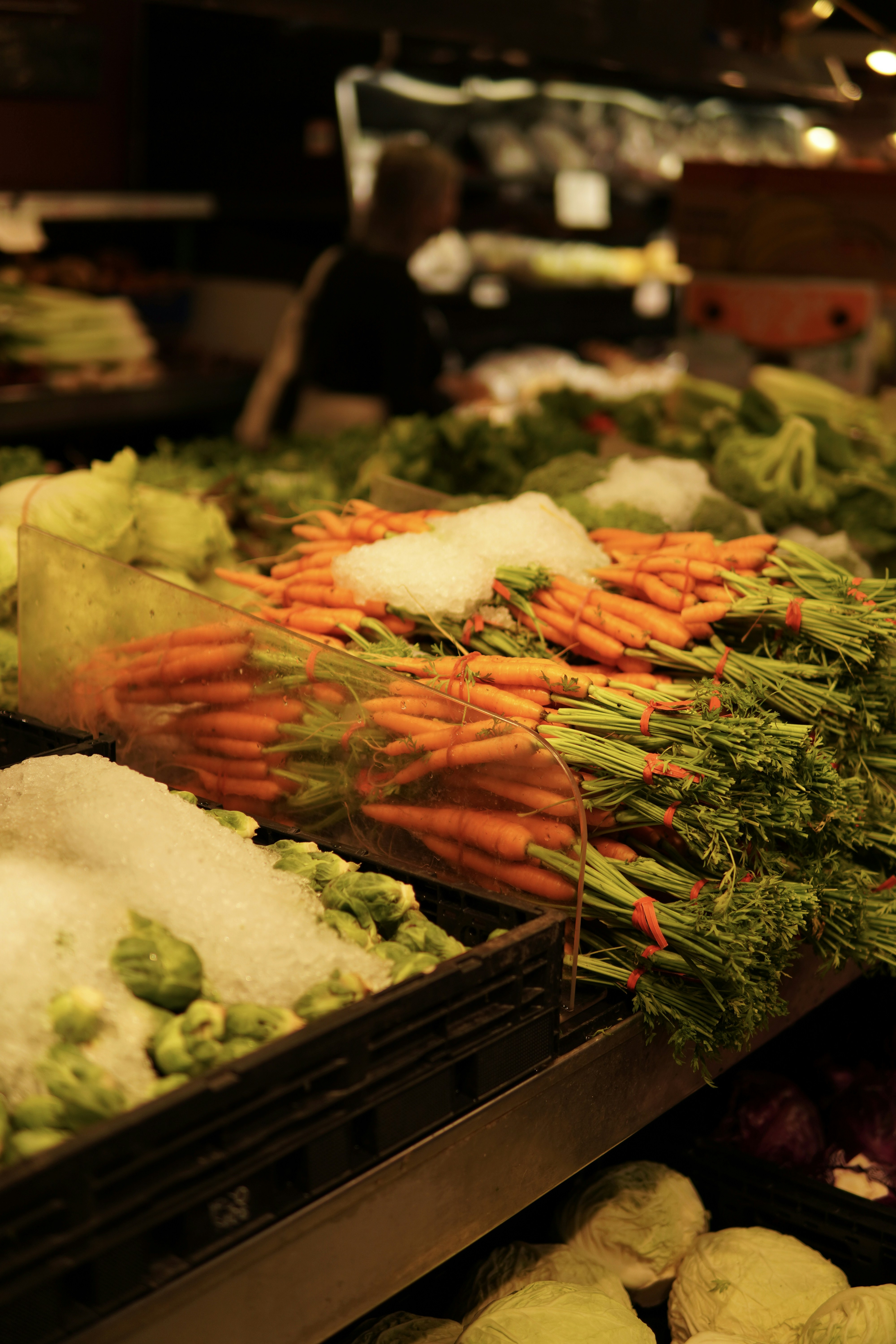 A bunch of carrots are on display in a store photo – Free Vancouver ...