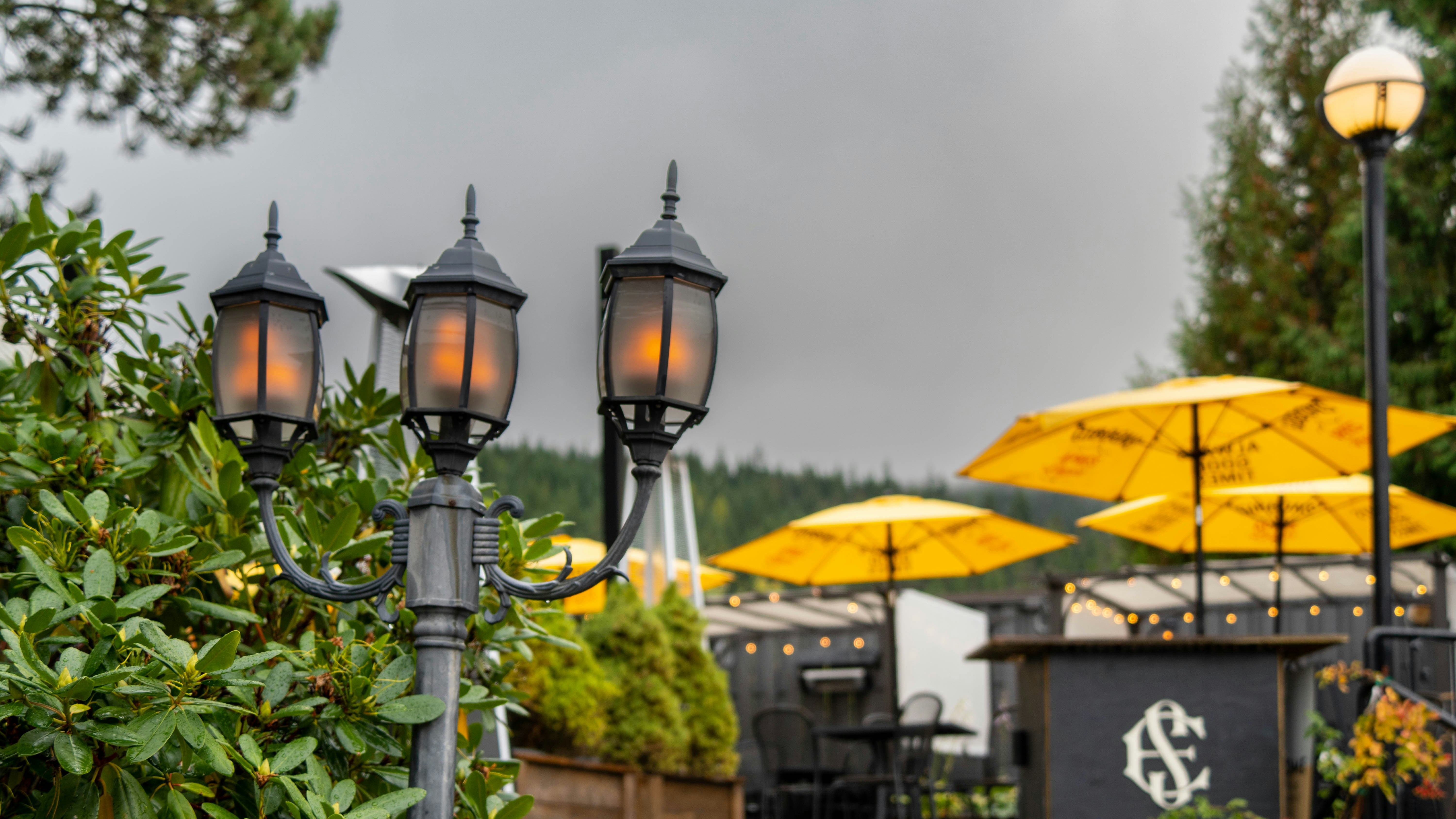 Gaslamp Gable: Warm Lanterns Framing a Courtyard in Evening Light