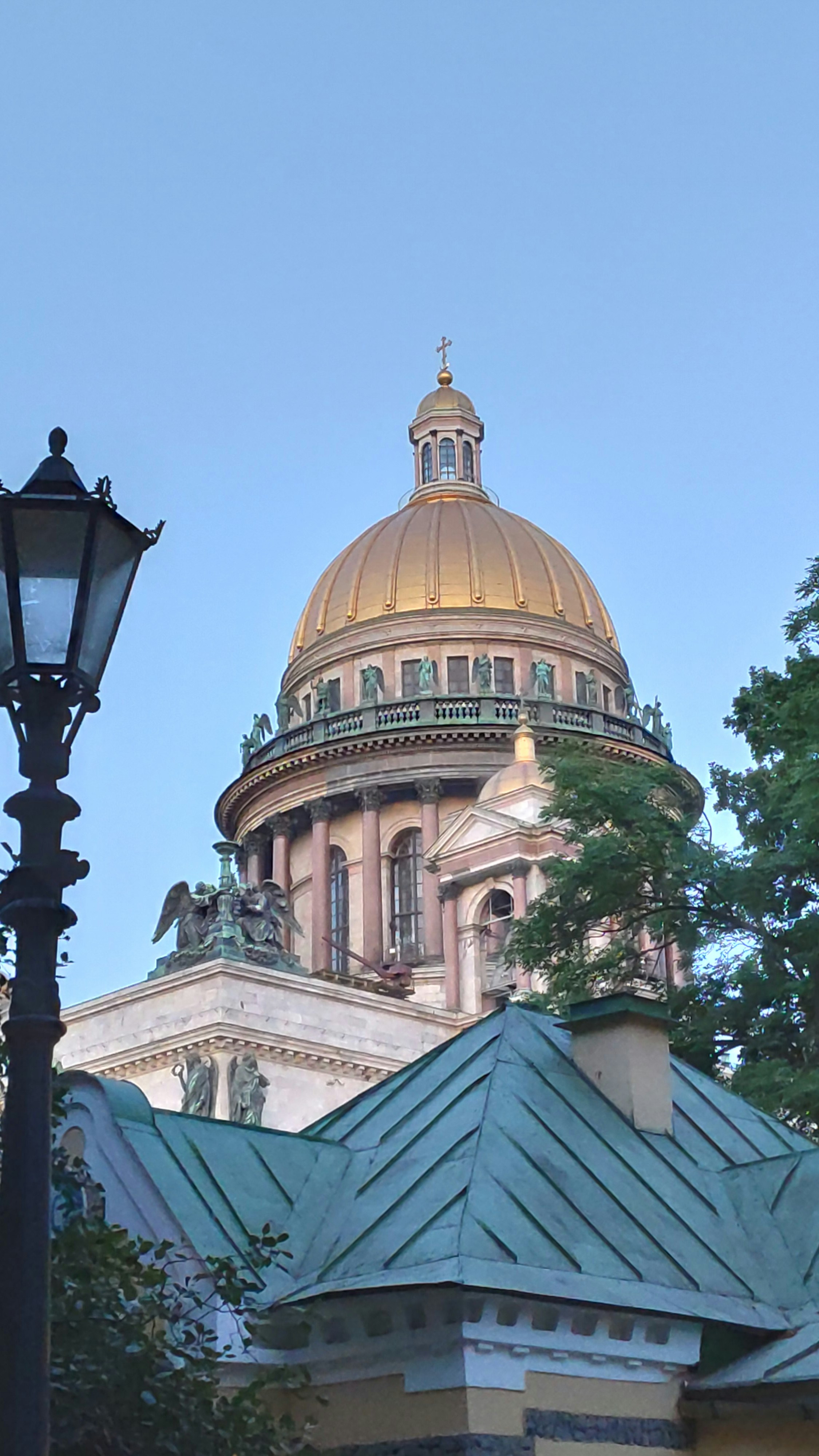 Gilded Dome Crowned by Light Over Teal Rooftops