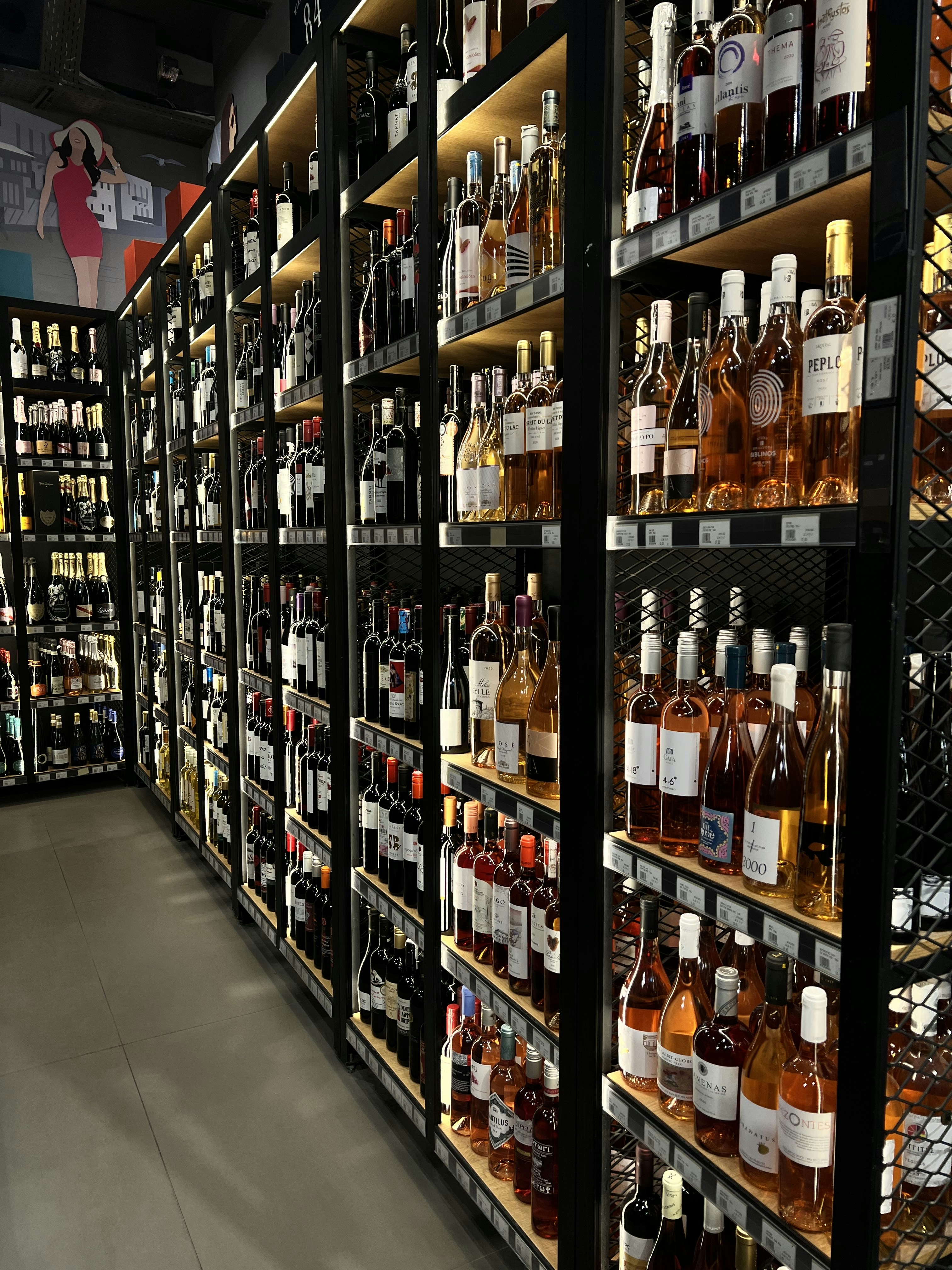 A store filled with lots of bottles of alcohol photo – Free Face Image ...