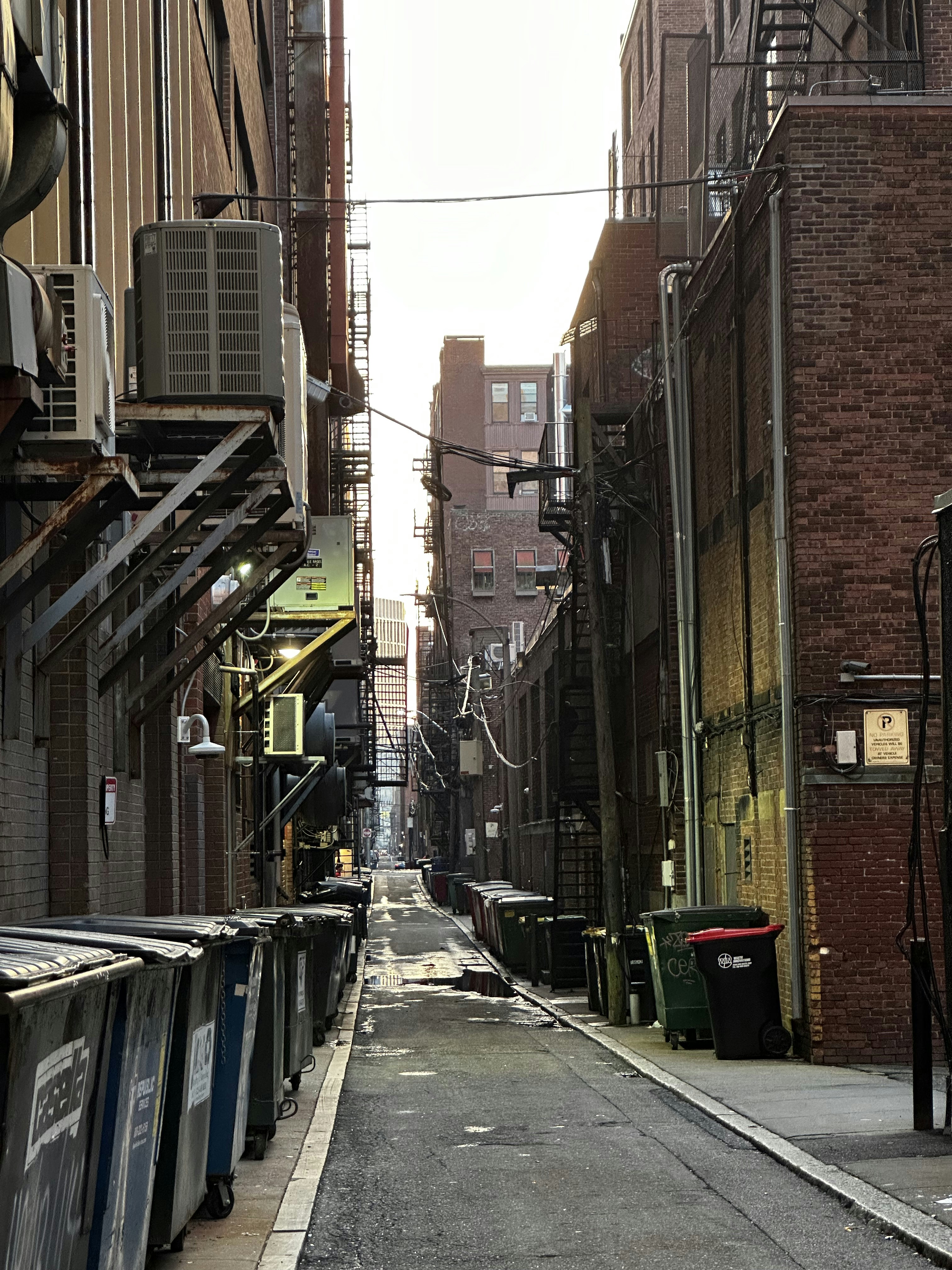 A city street with trash cans and buildings photo – Free Boston Image ...