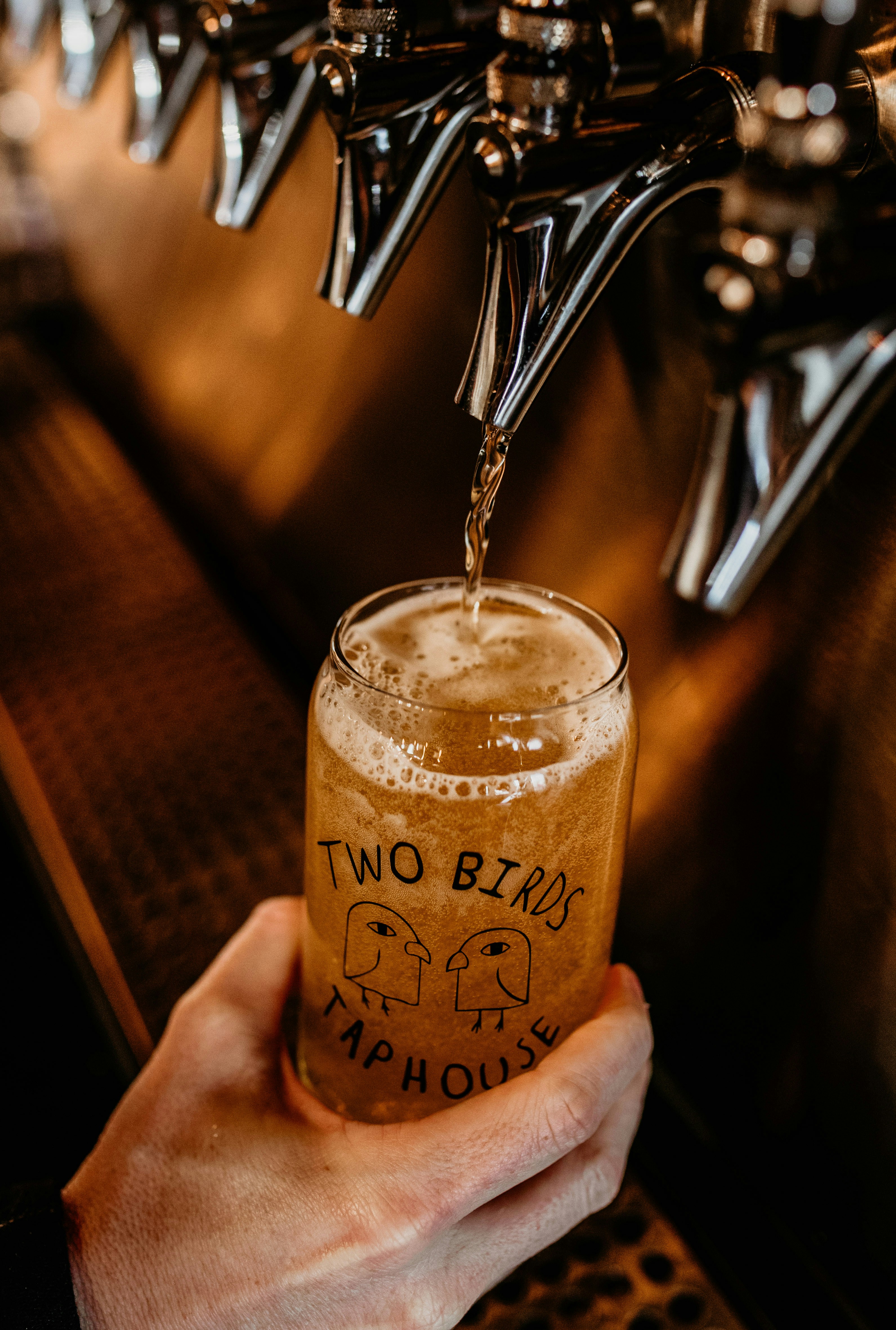 pouring tap beer into glass