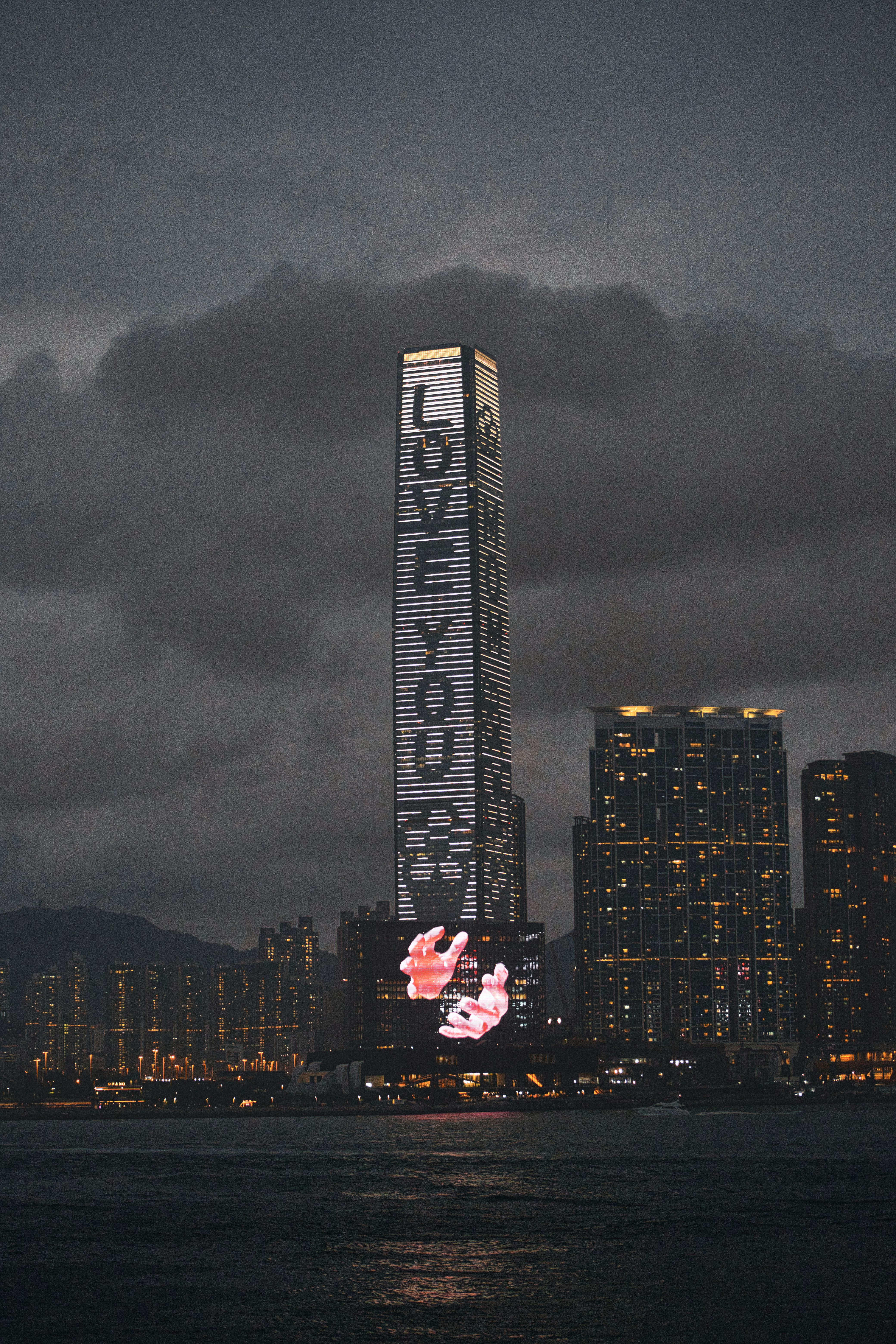 LOVEYOU Tower at Dusk: Neon Letters Guiding a Quiet Harbor