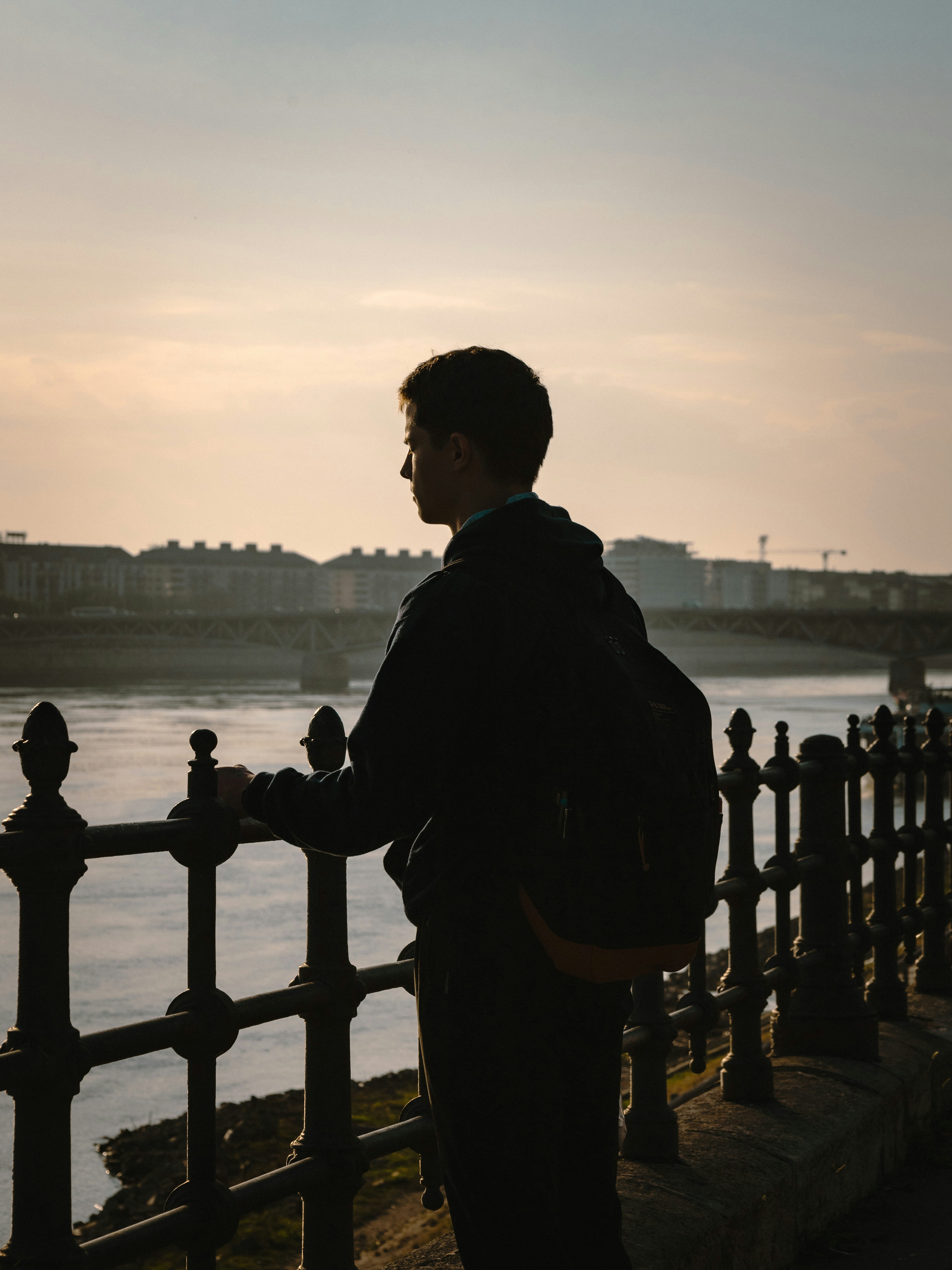 Dusk Watcher by the River Rail