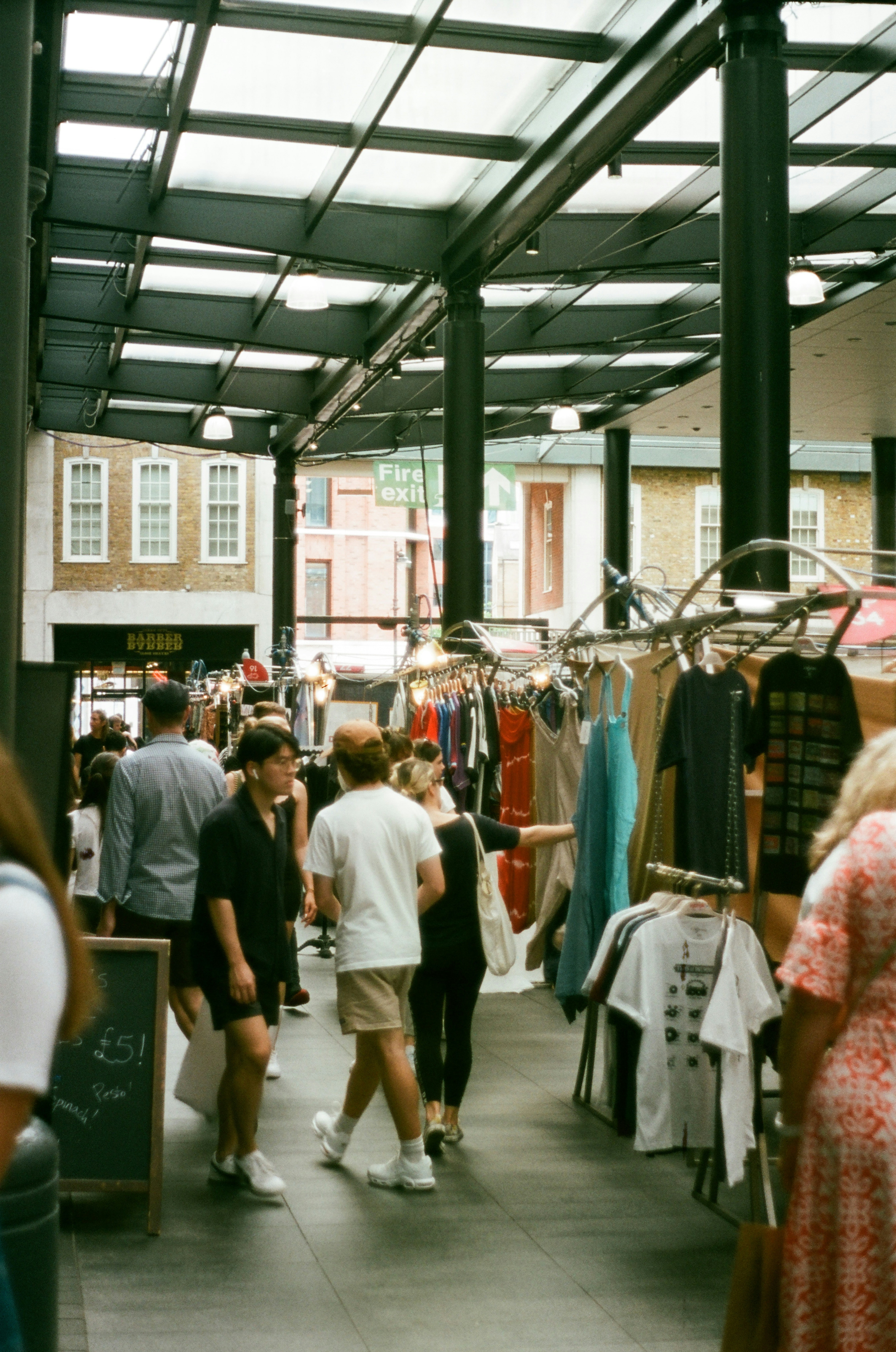 A group of people walking around a store photo – Free London Image on ...
