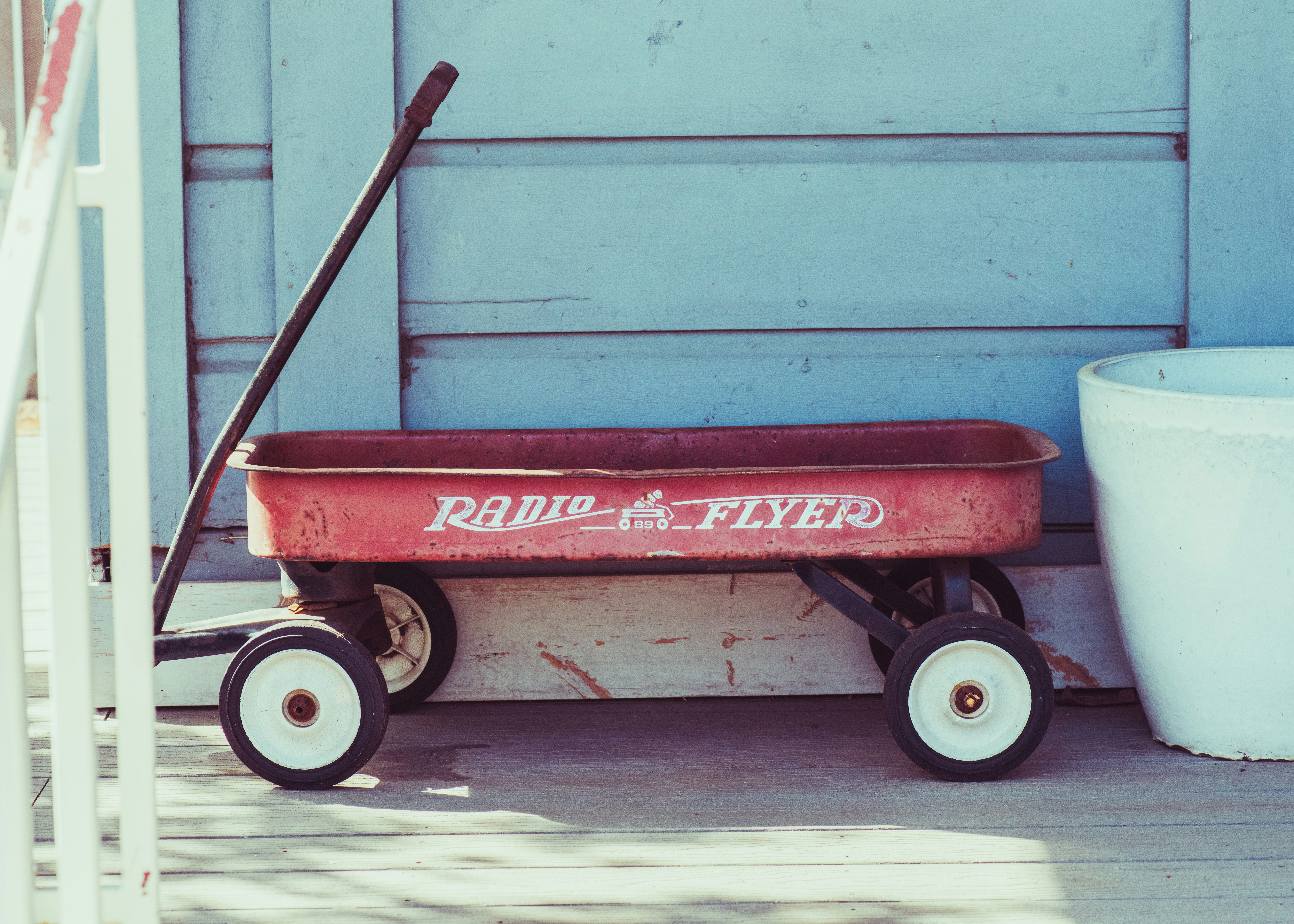 Radio Flyer wagon on porch | a red radio flyer wagon sitting on a porch