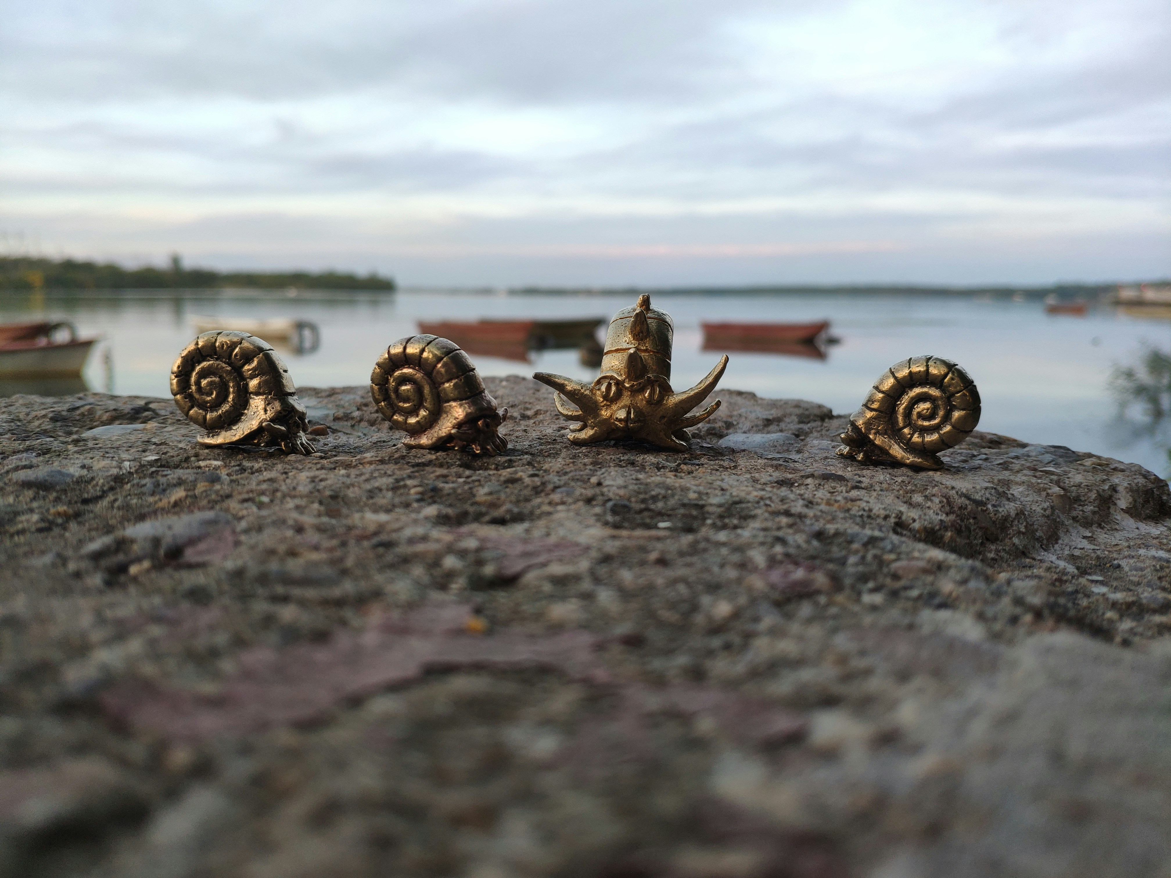 A group of snails sitting on top of a rock photo – Free Pokemon Image ...