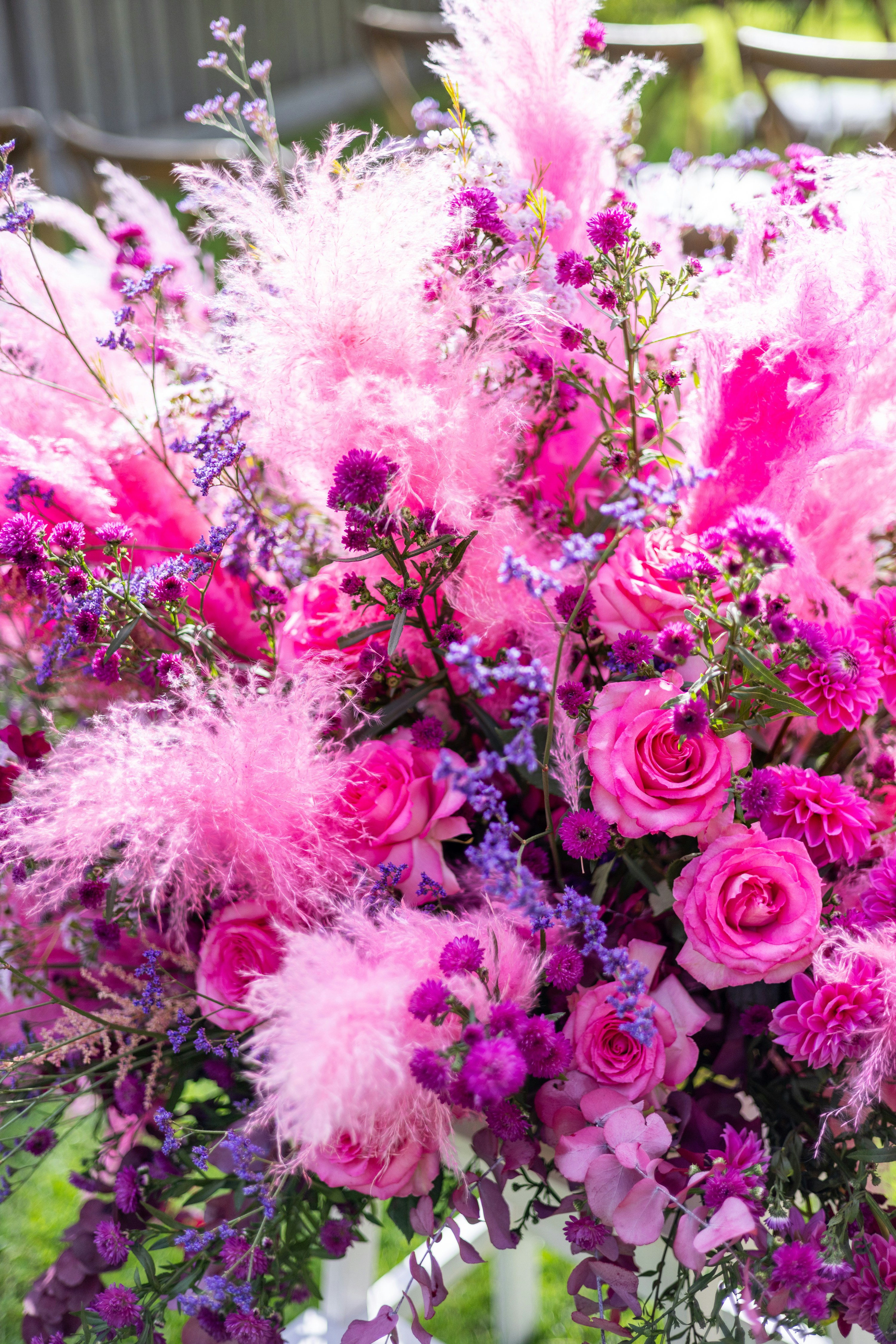 Rosy Crescendo: A Floral Cascade of Pink Roses and Feathery Pampas