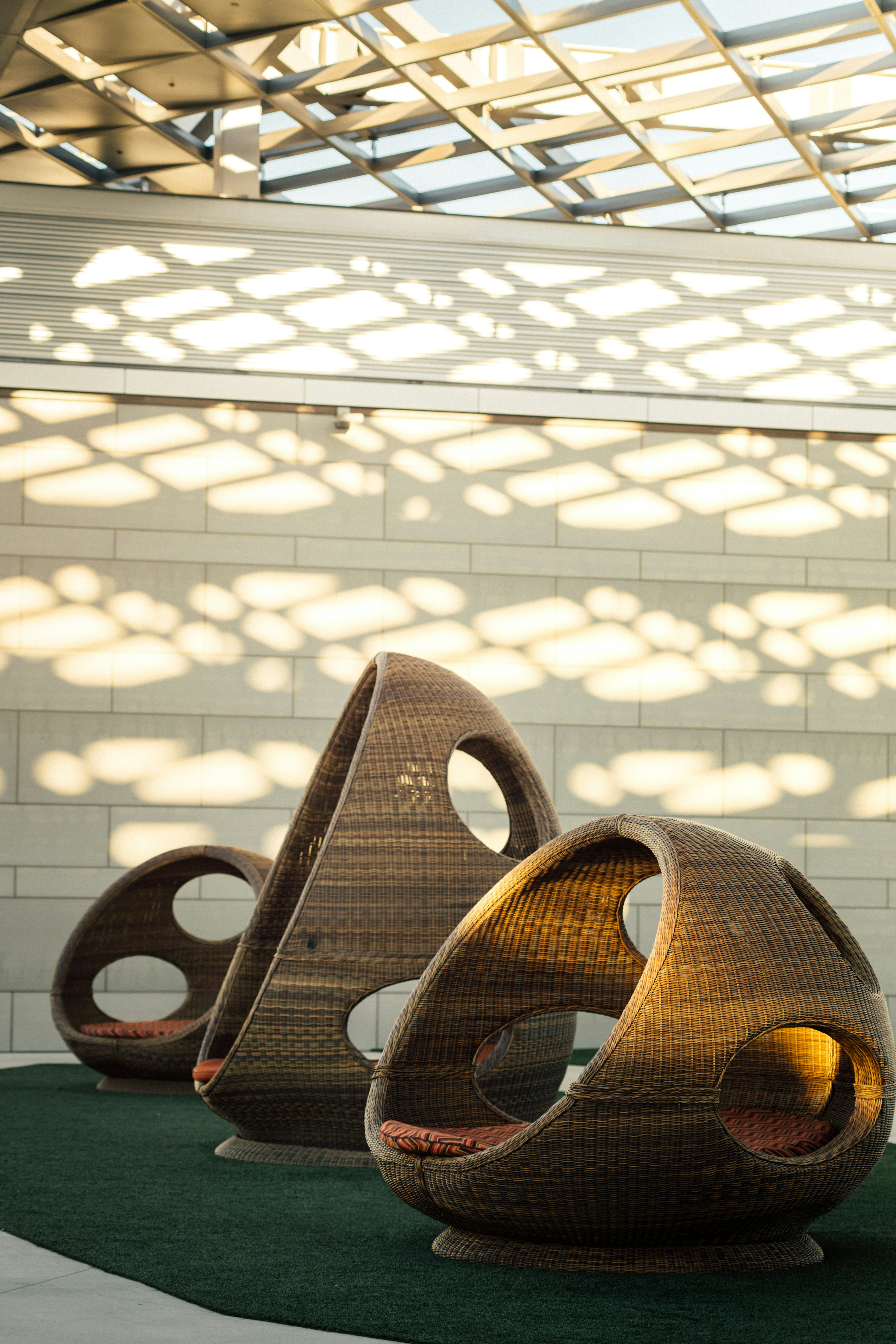 Sculpted wicker domes under dappled late-afternoon light