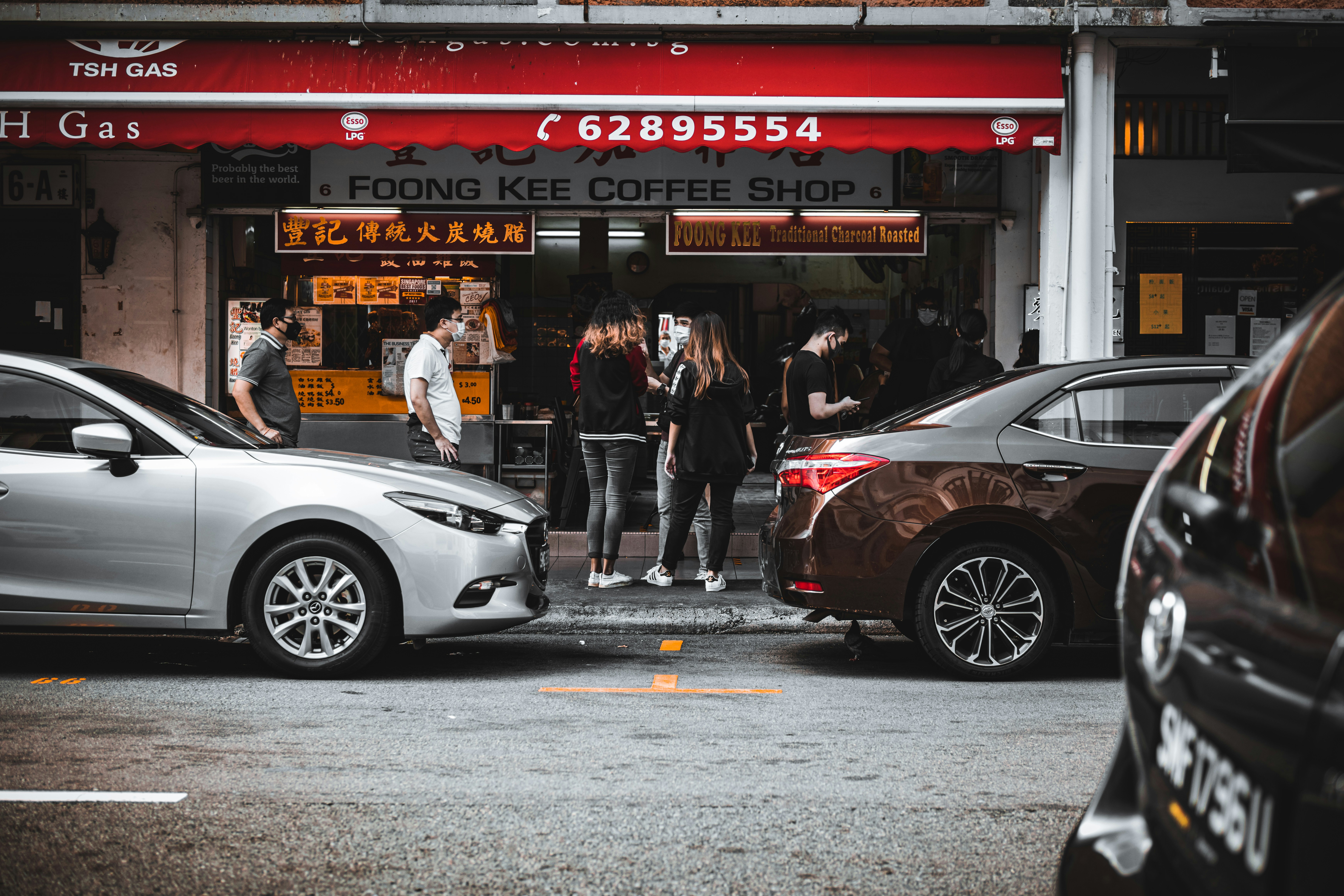 Street Queue at a Coffee Shop Facade