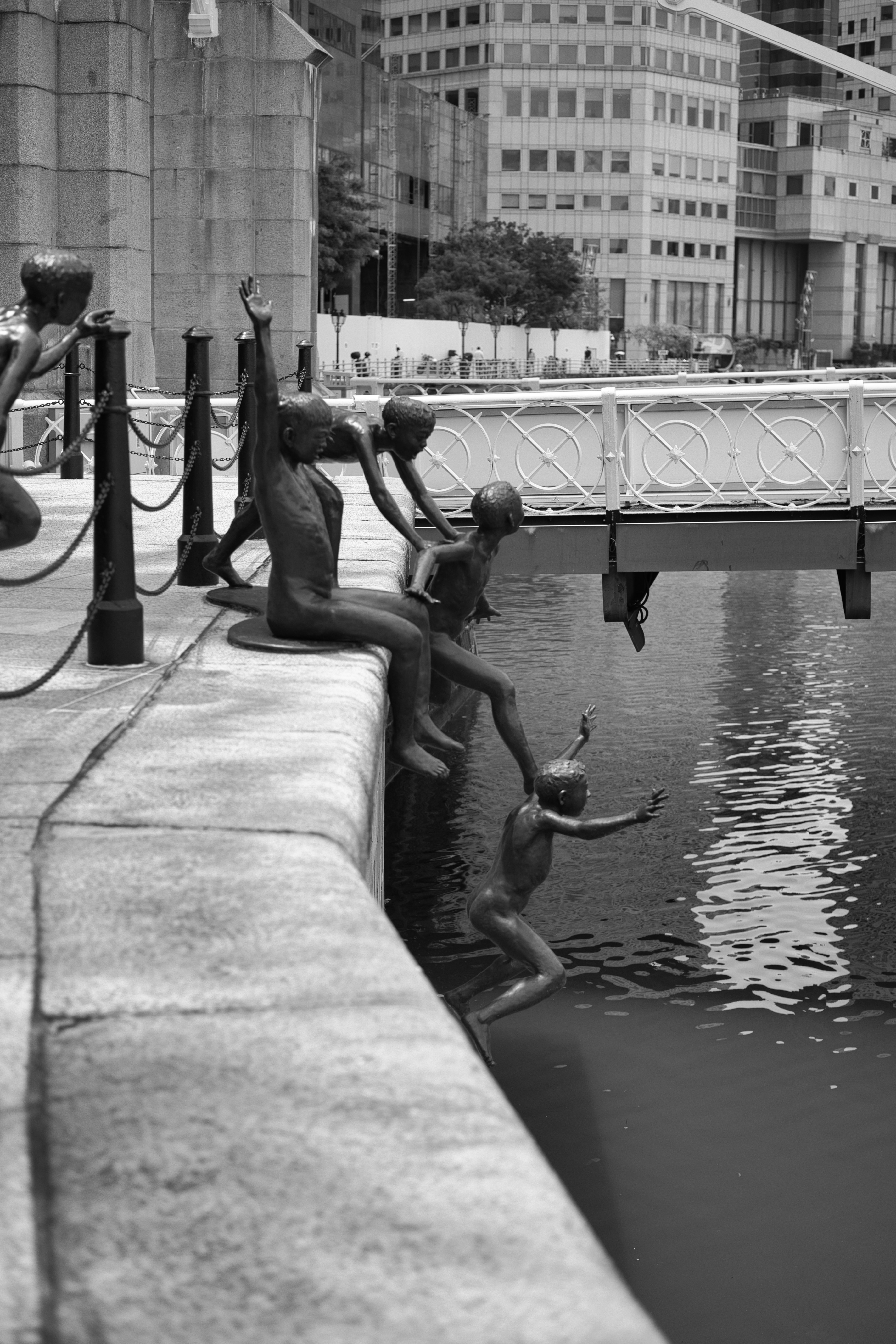 Kids of the Water: Bronze Figures Descend into the River Reach