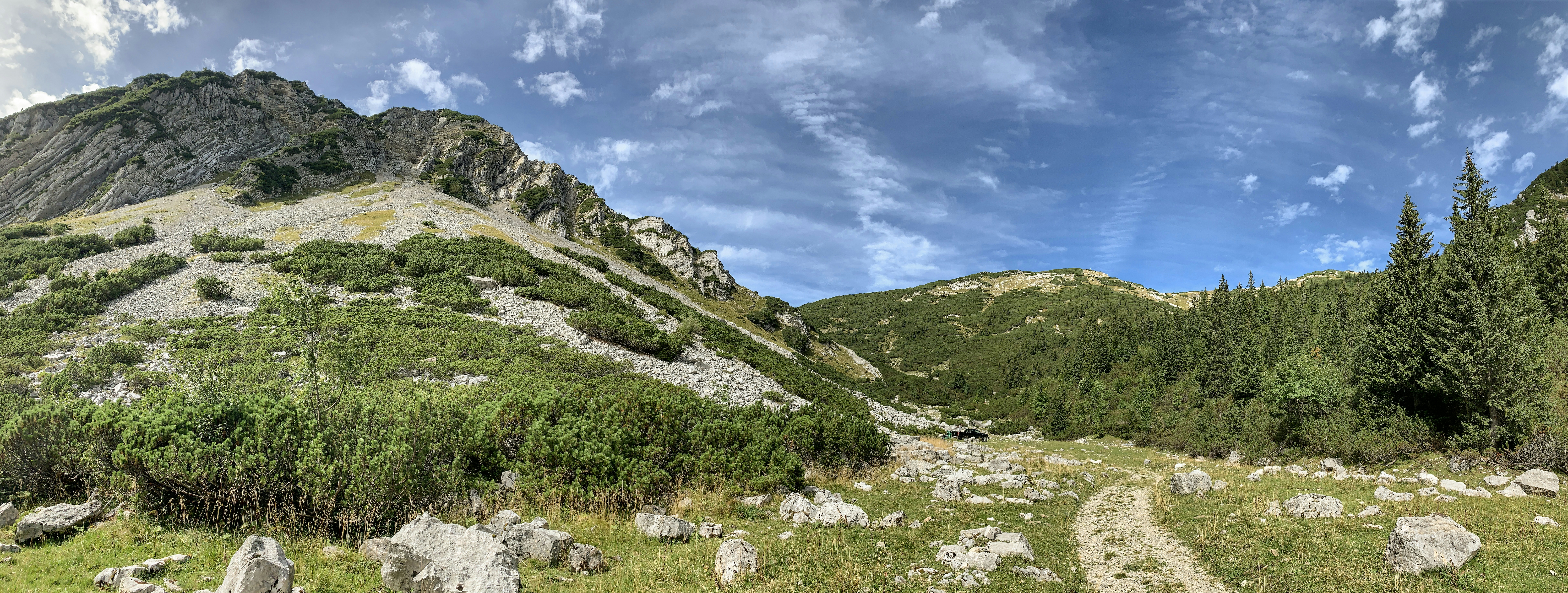 A mountain with a trail going through it photo – Free Clouds Image on ...