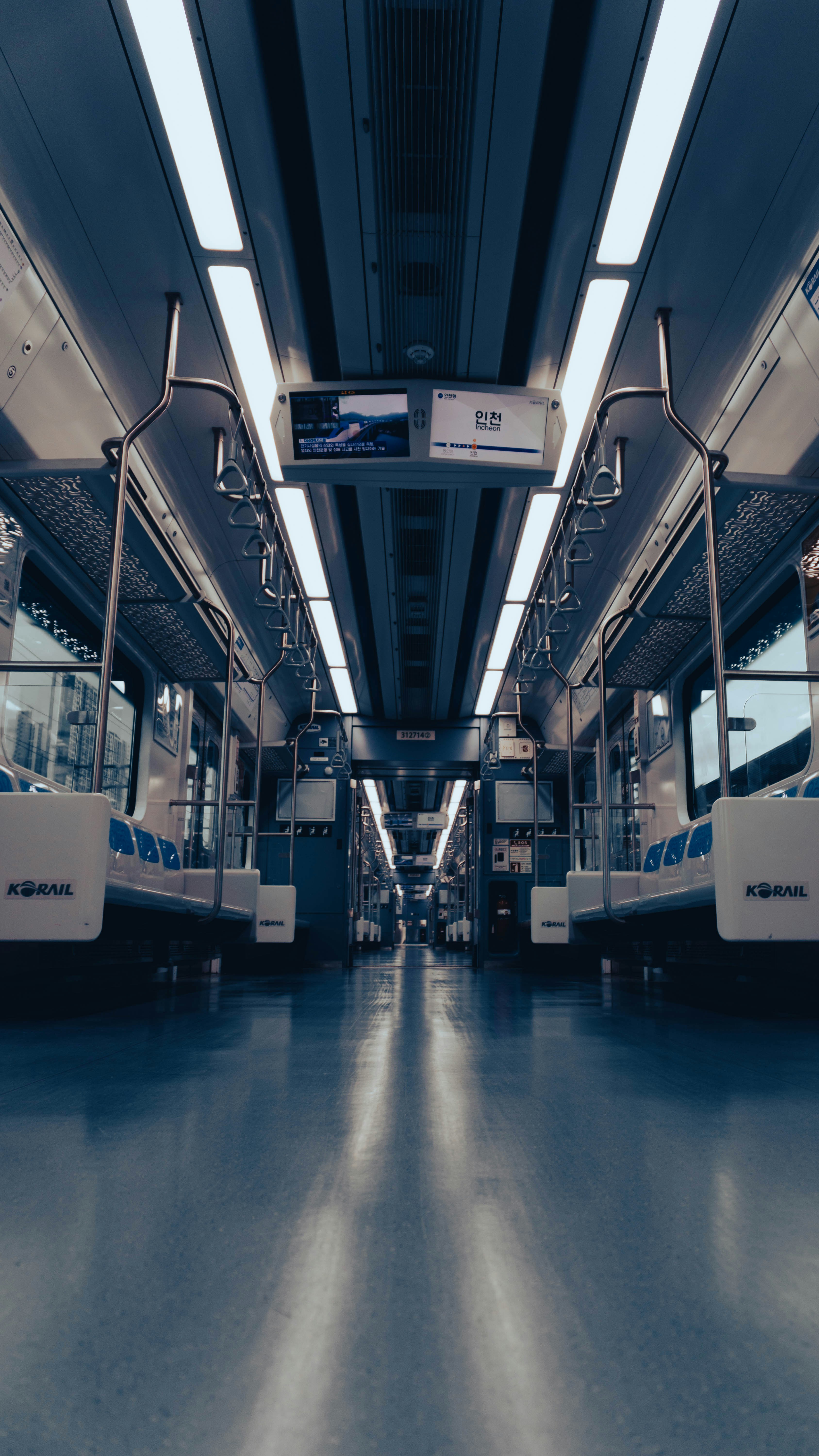 Convergence Aisle: The Vanishing Point of a Quiet Railway Car