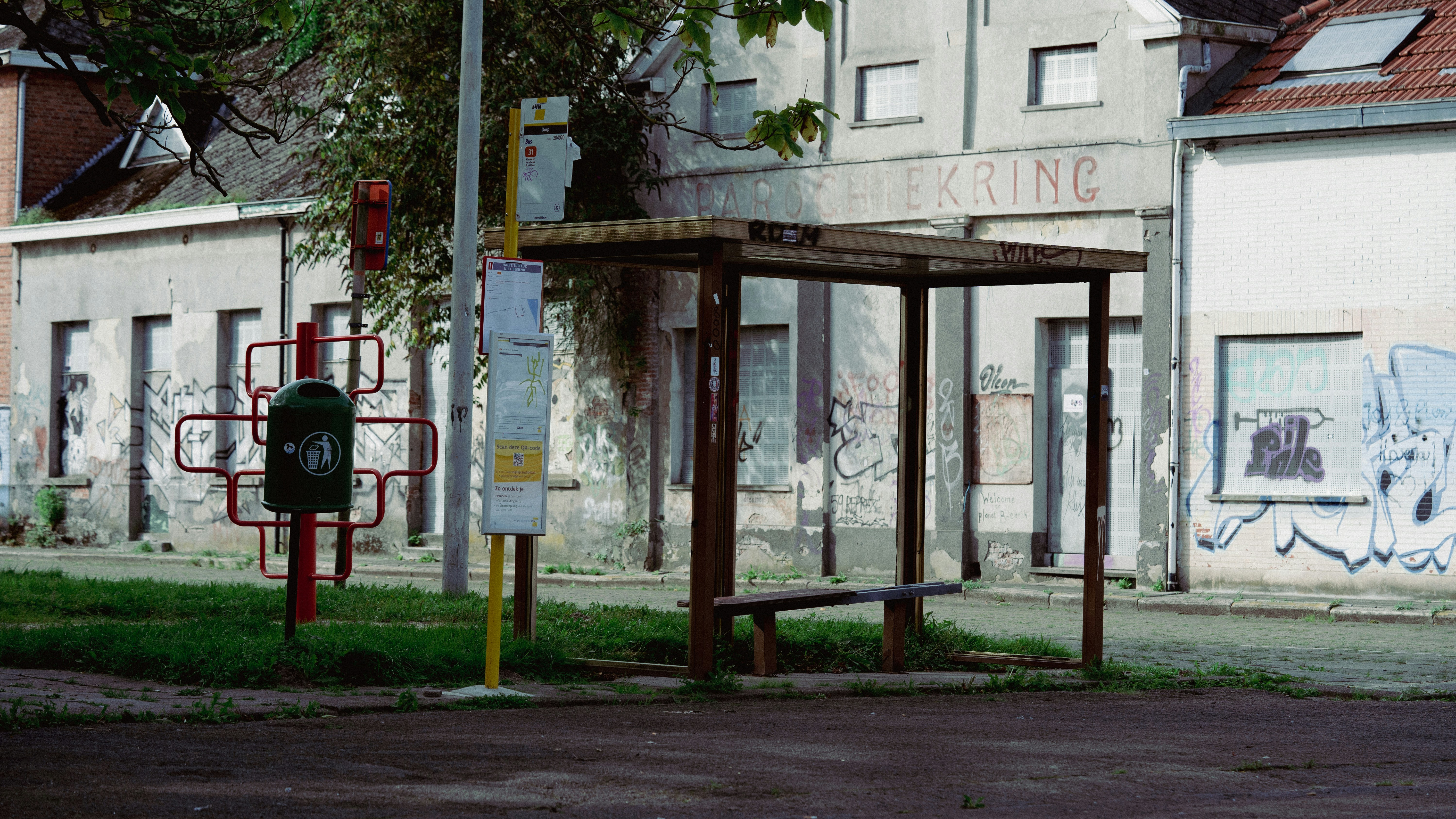 Solitary Bus Shelter Framed by Graffiti-Washed Walls