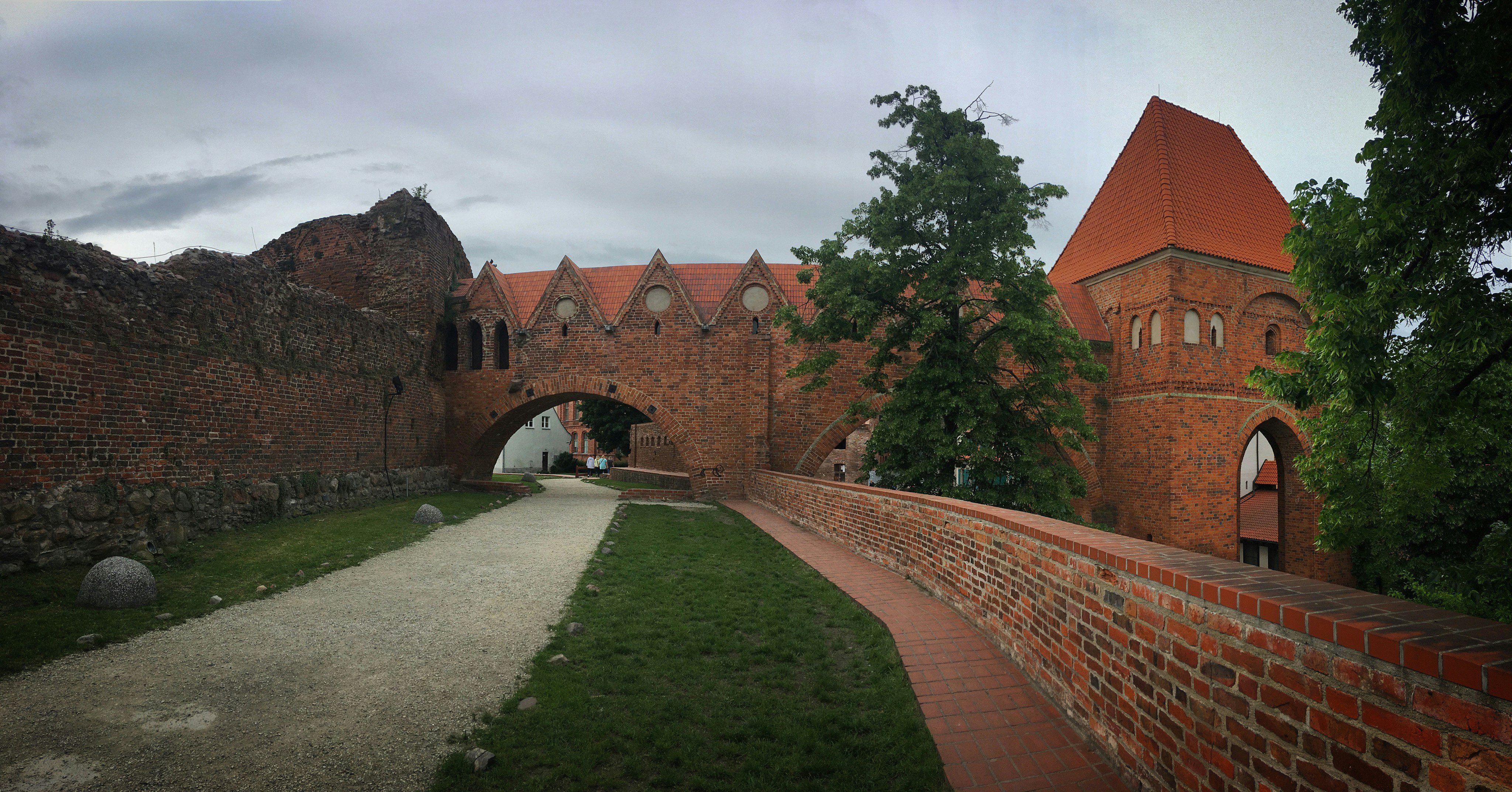 Gateway in Red Brick: A Quiet Walk Toward the Fortress Arch