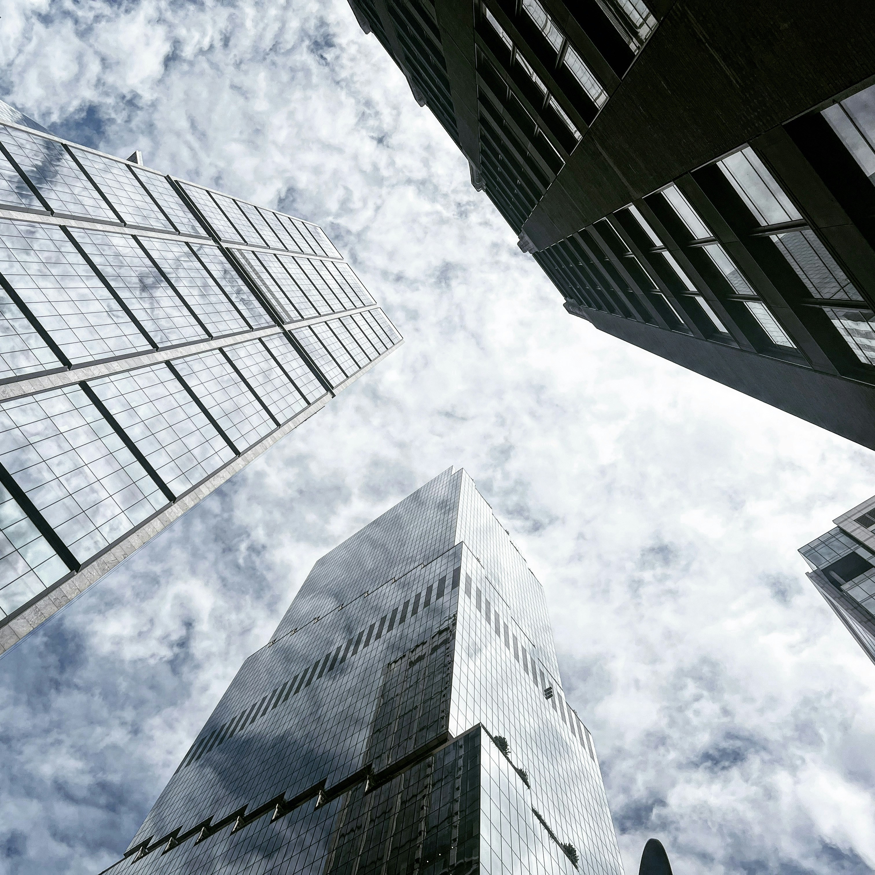 A group of tall buildings standing next to each other photo – Free ...